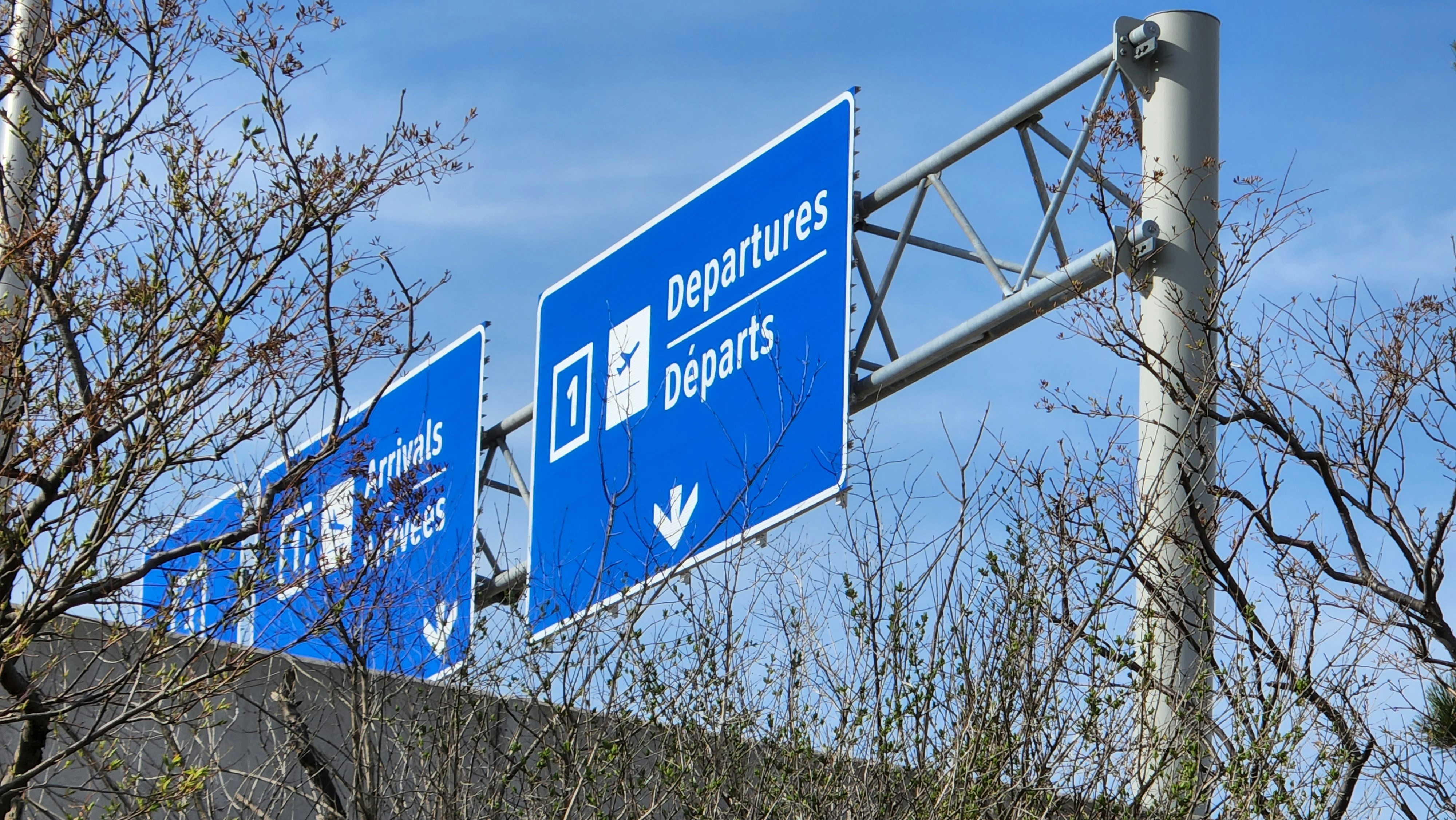 A street sign on a pole photo – Free Toronto pearson international ...