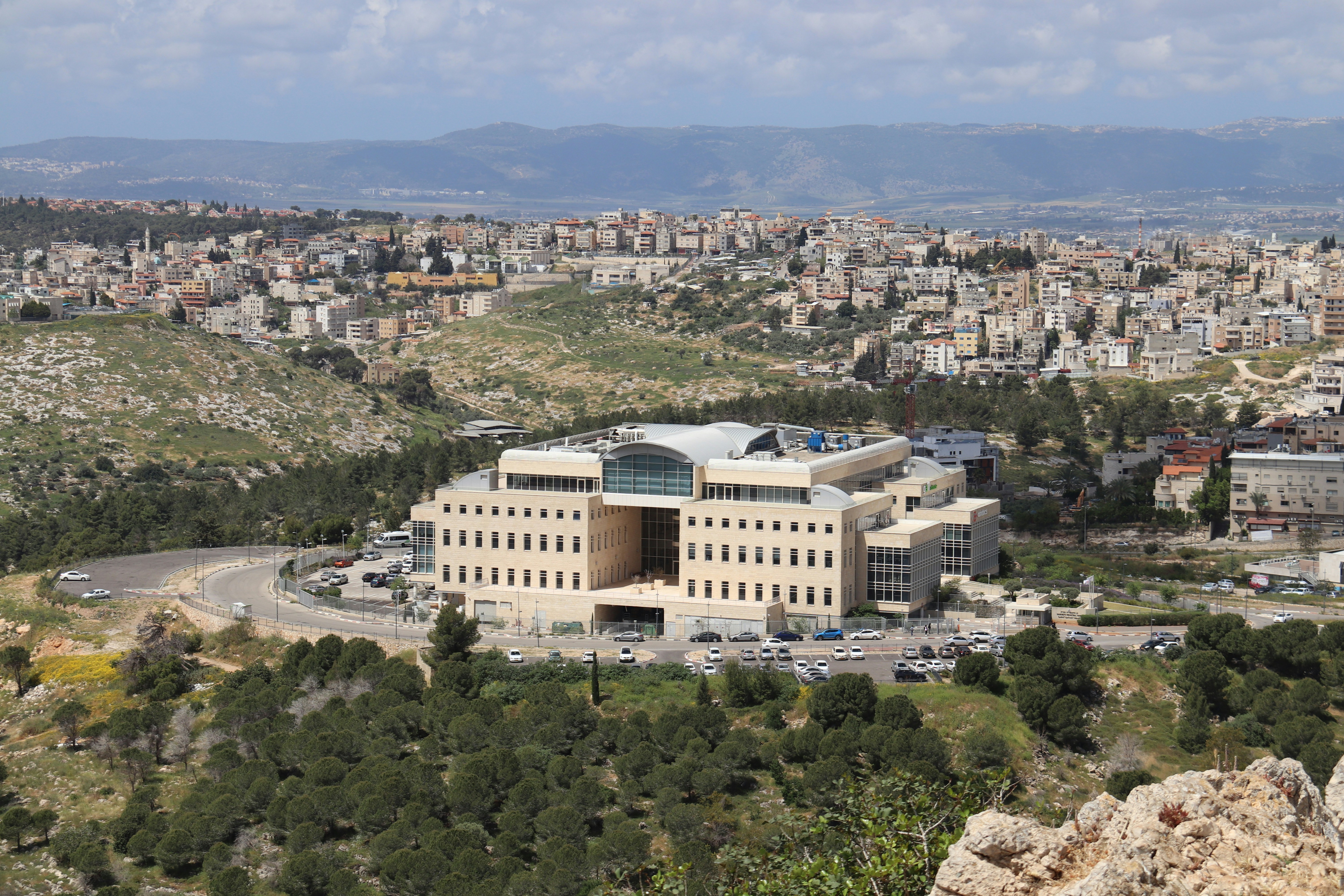 A large building surrounded by trees photo – Free Mount precipice Image ...