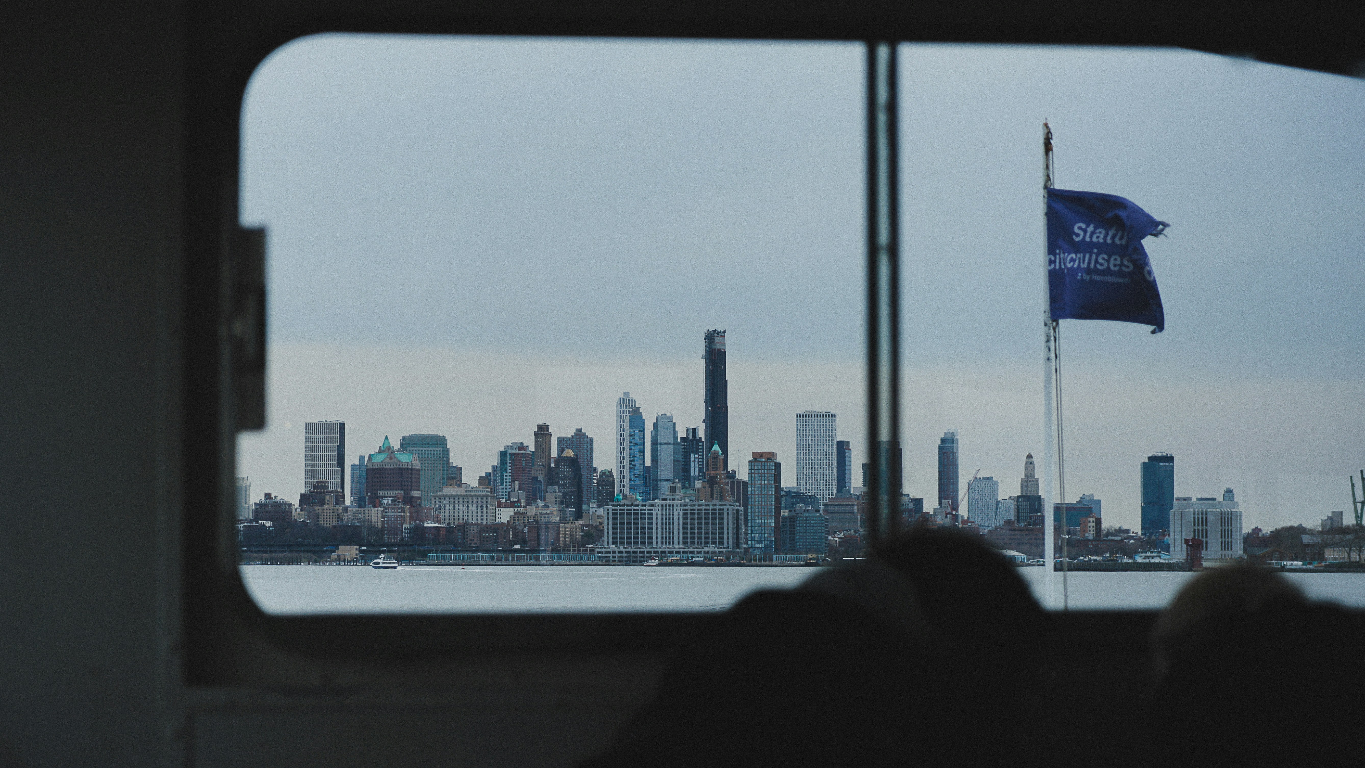 Harbor View Through a Ferry Window at Dusk