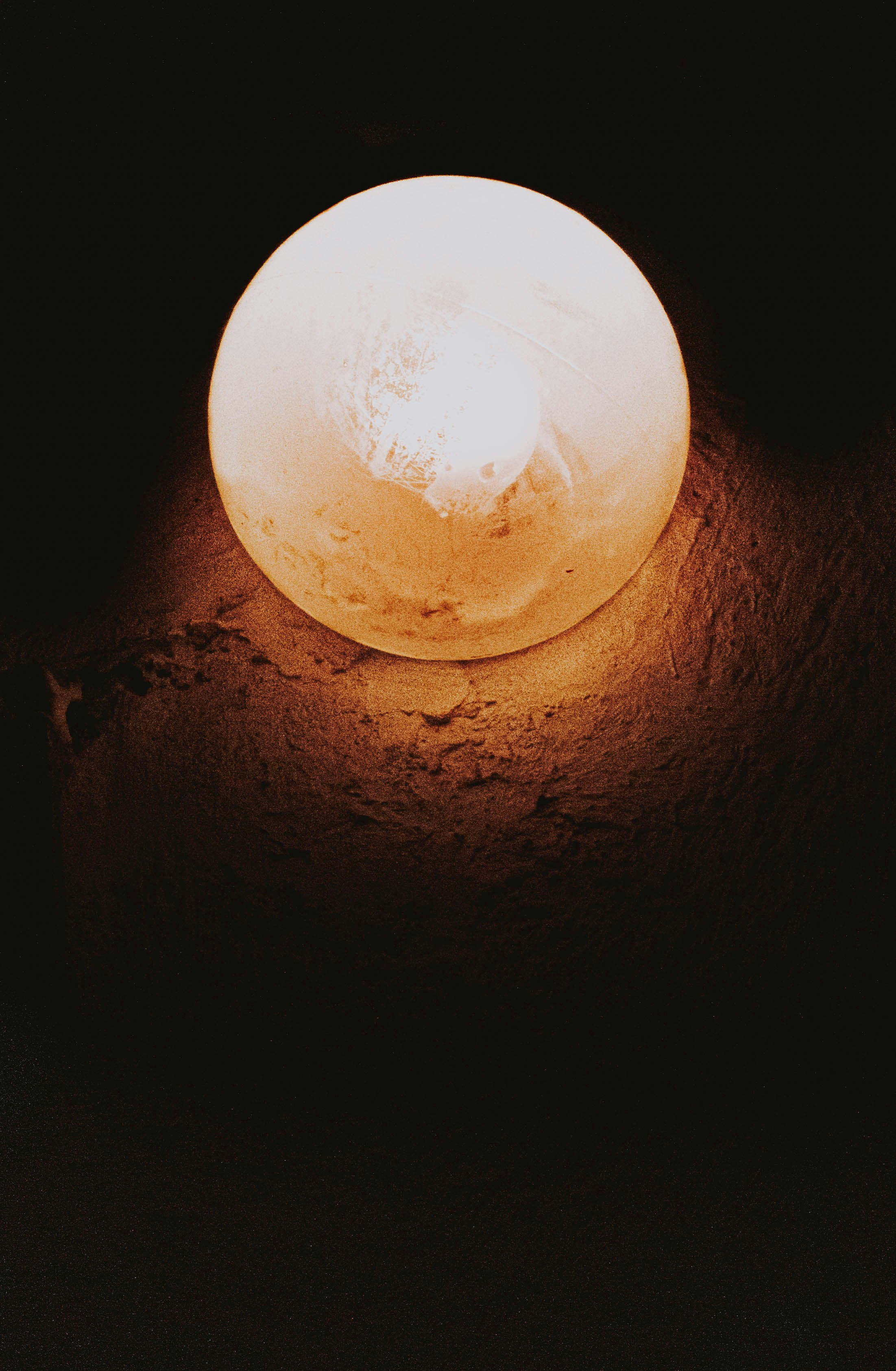 Luminous Sphere Emerges from Shadowed Ground