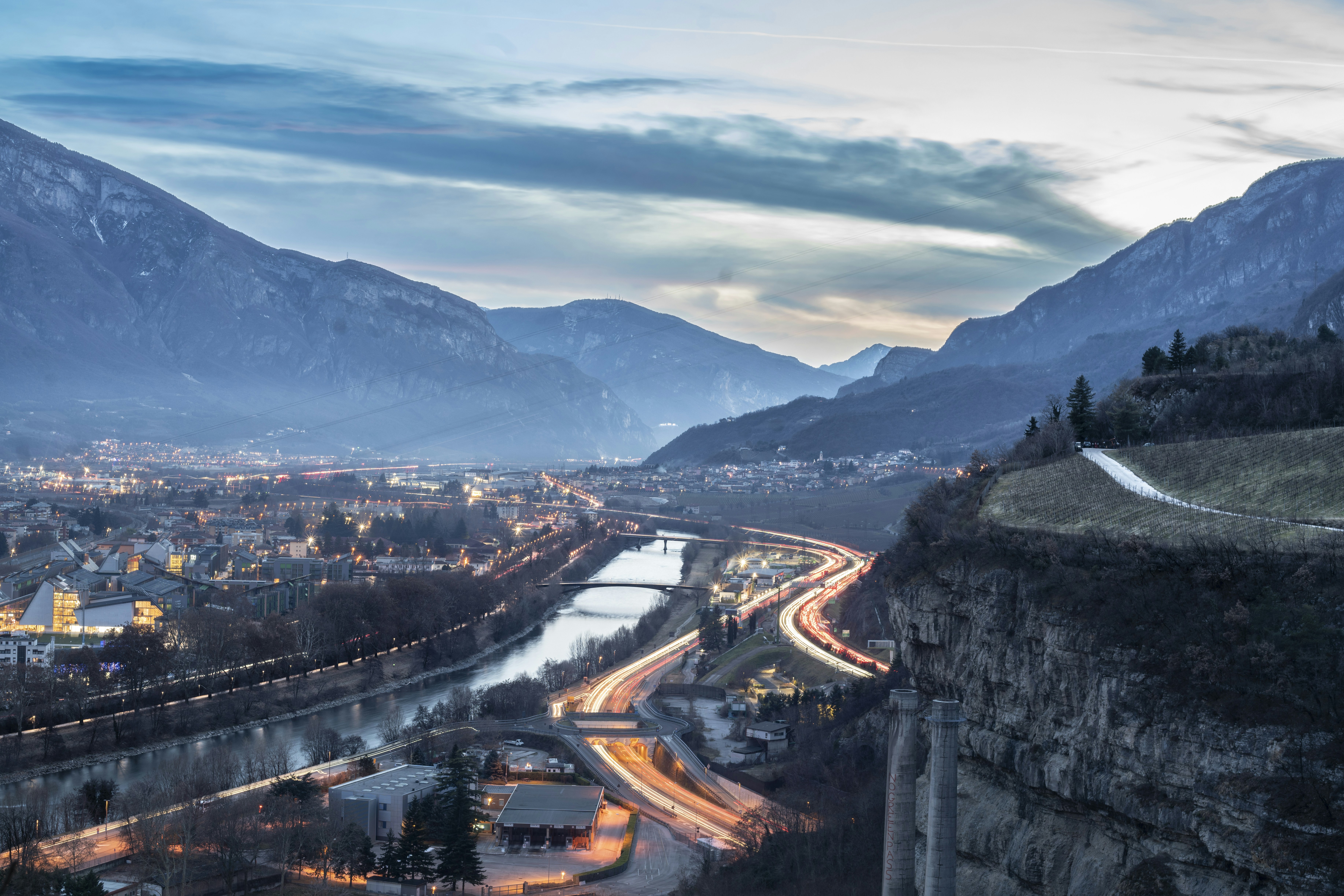 Doss Trento | a city with mountains and a river