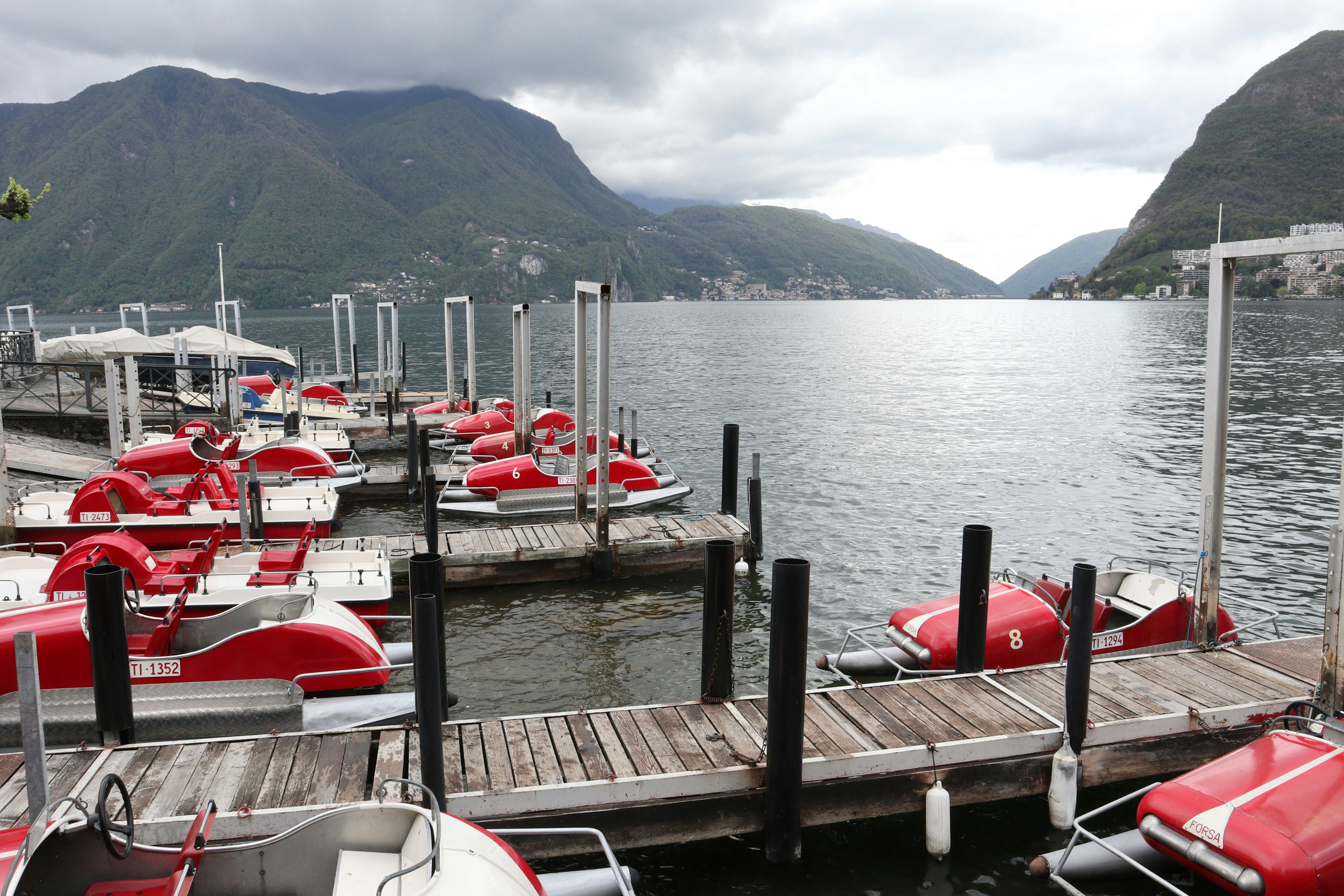 A dock with boats photo – Free Lugano Image on Unsplash