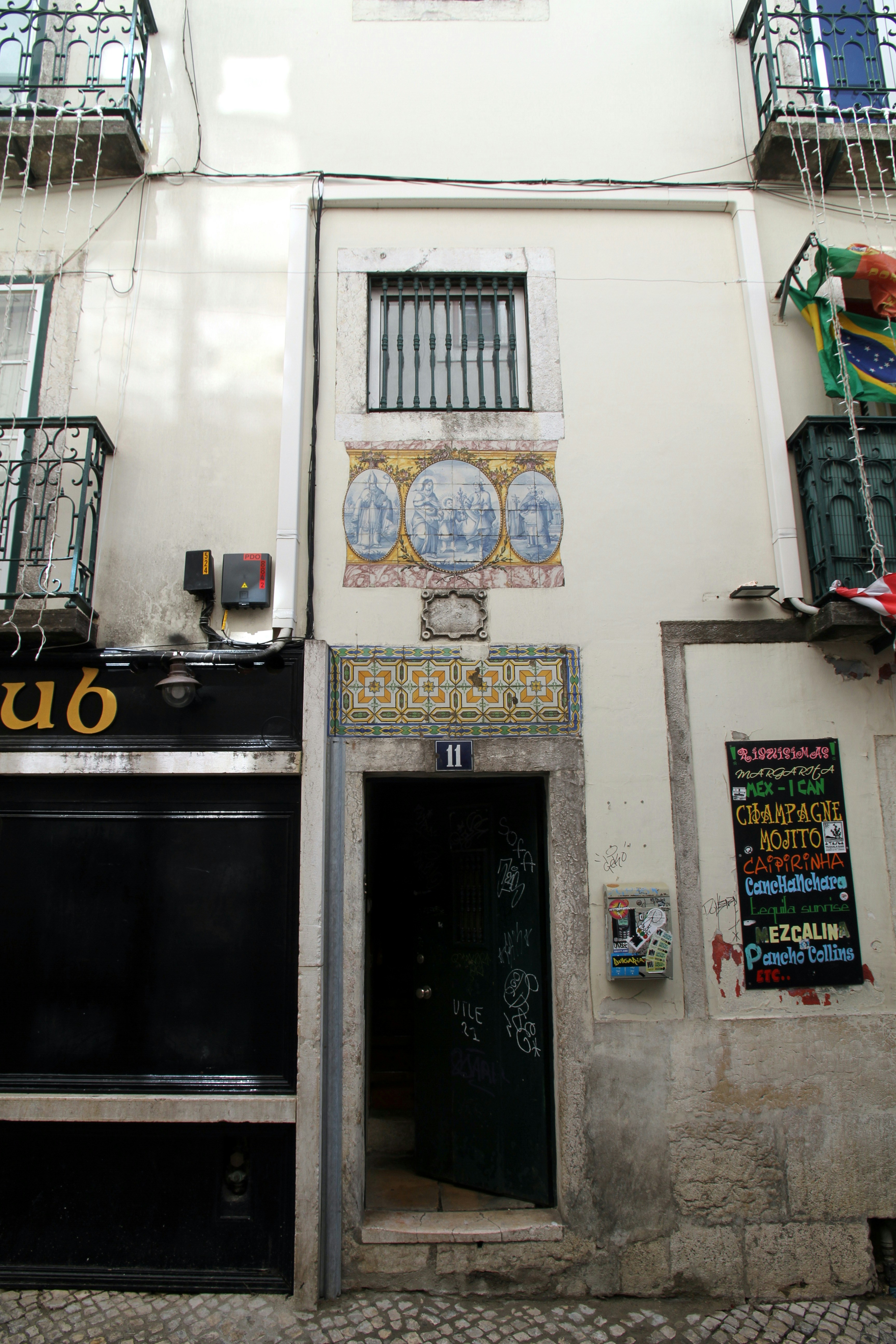 Azulejo Medallions Framing a Quiet Lisbon Door