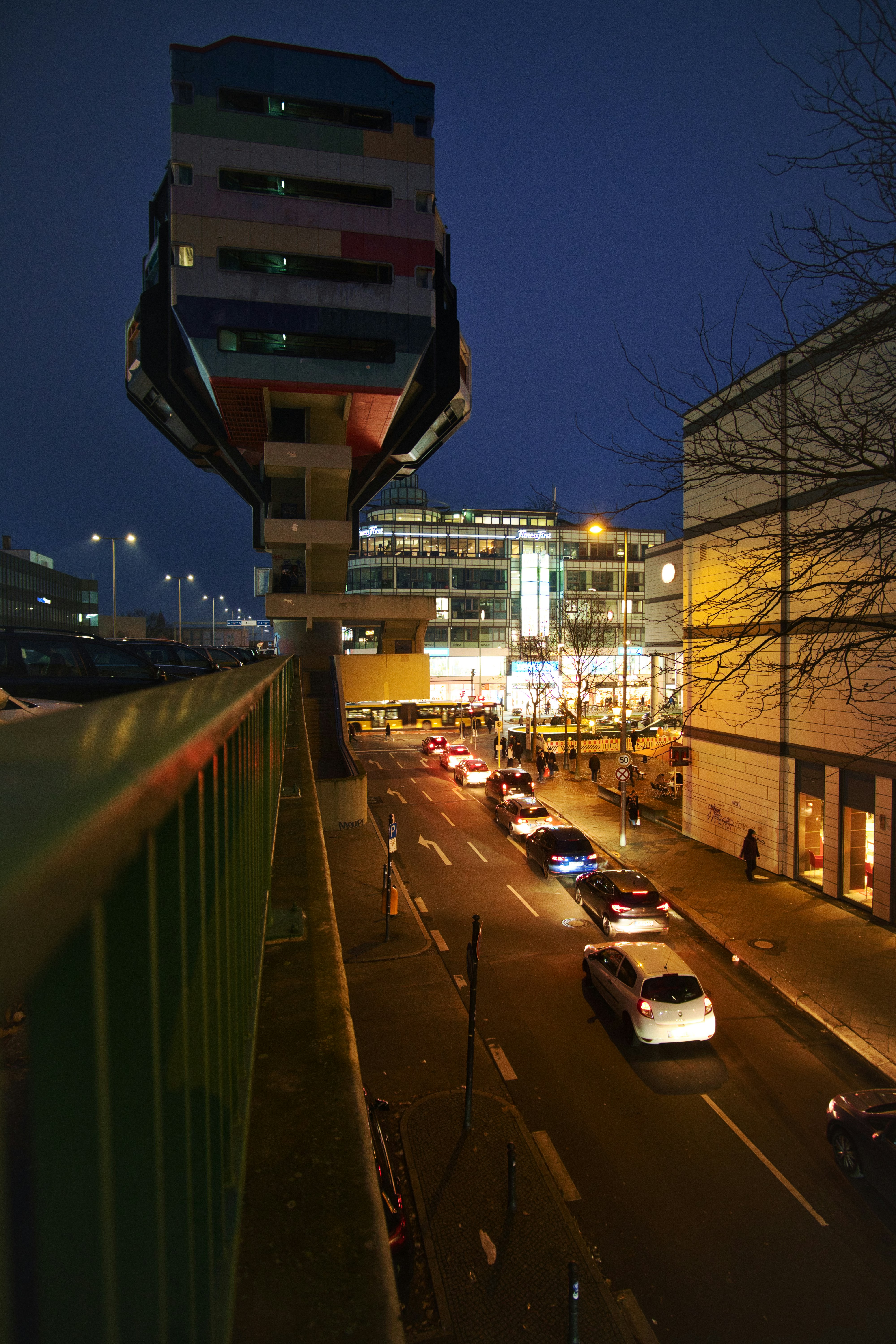 a street with cars and buildings on either side of it