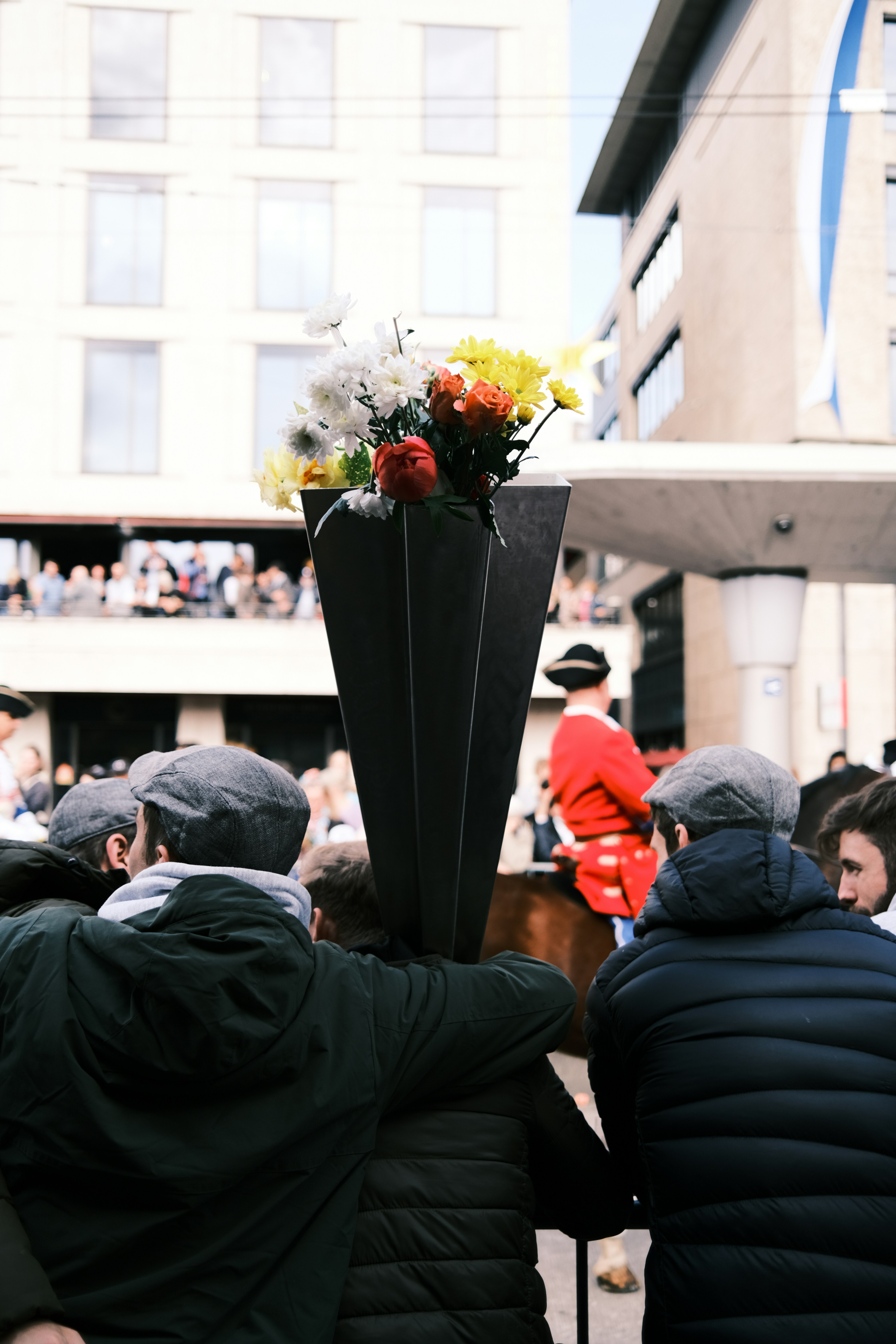 Blossoms Above the Parade: A City Square Moment