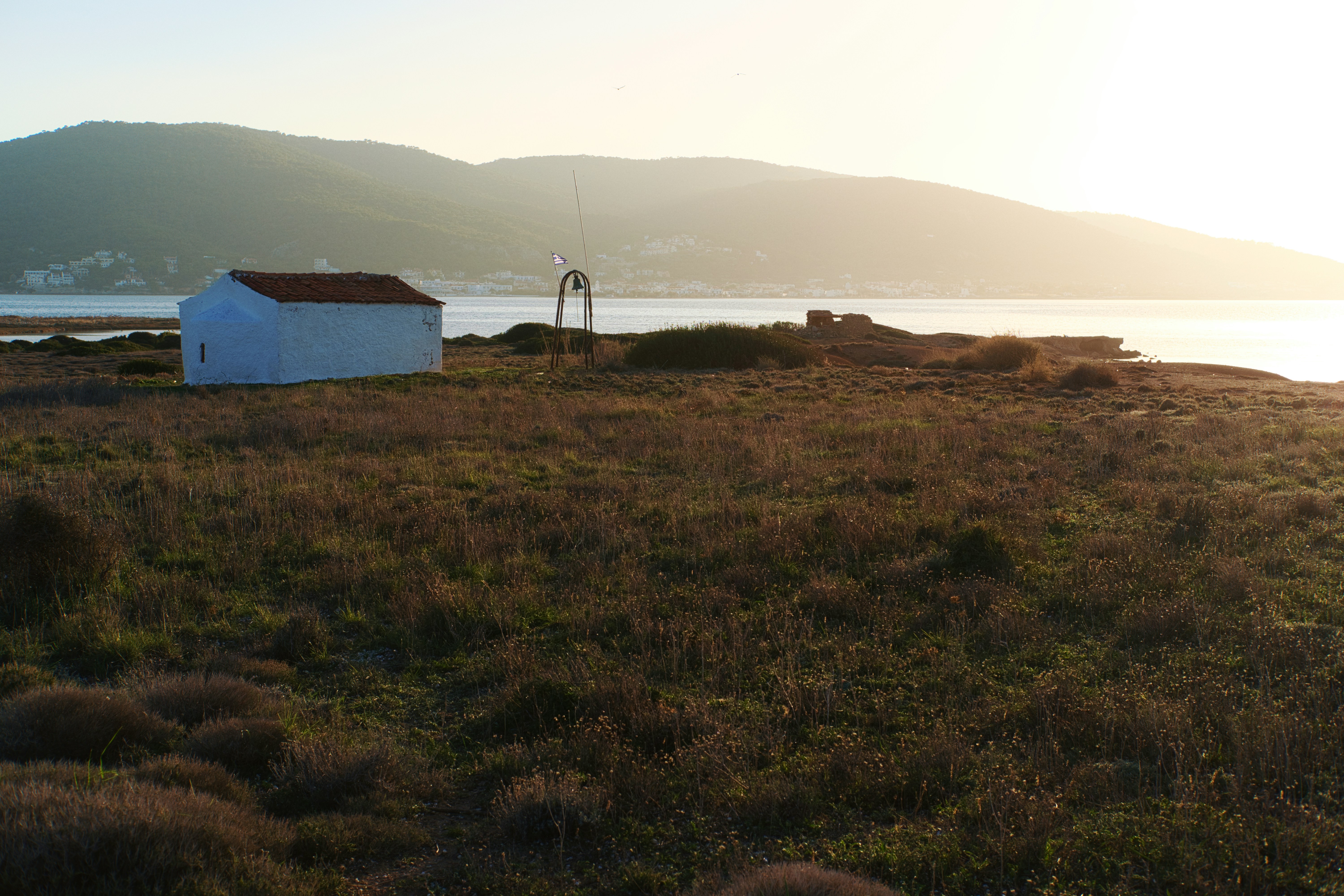 A building in a field photo – Free Greece Image on Unsplash