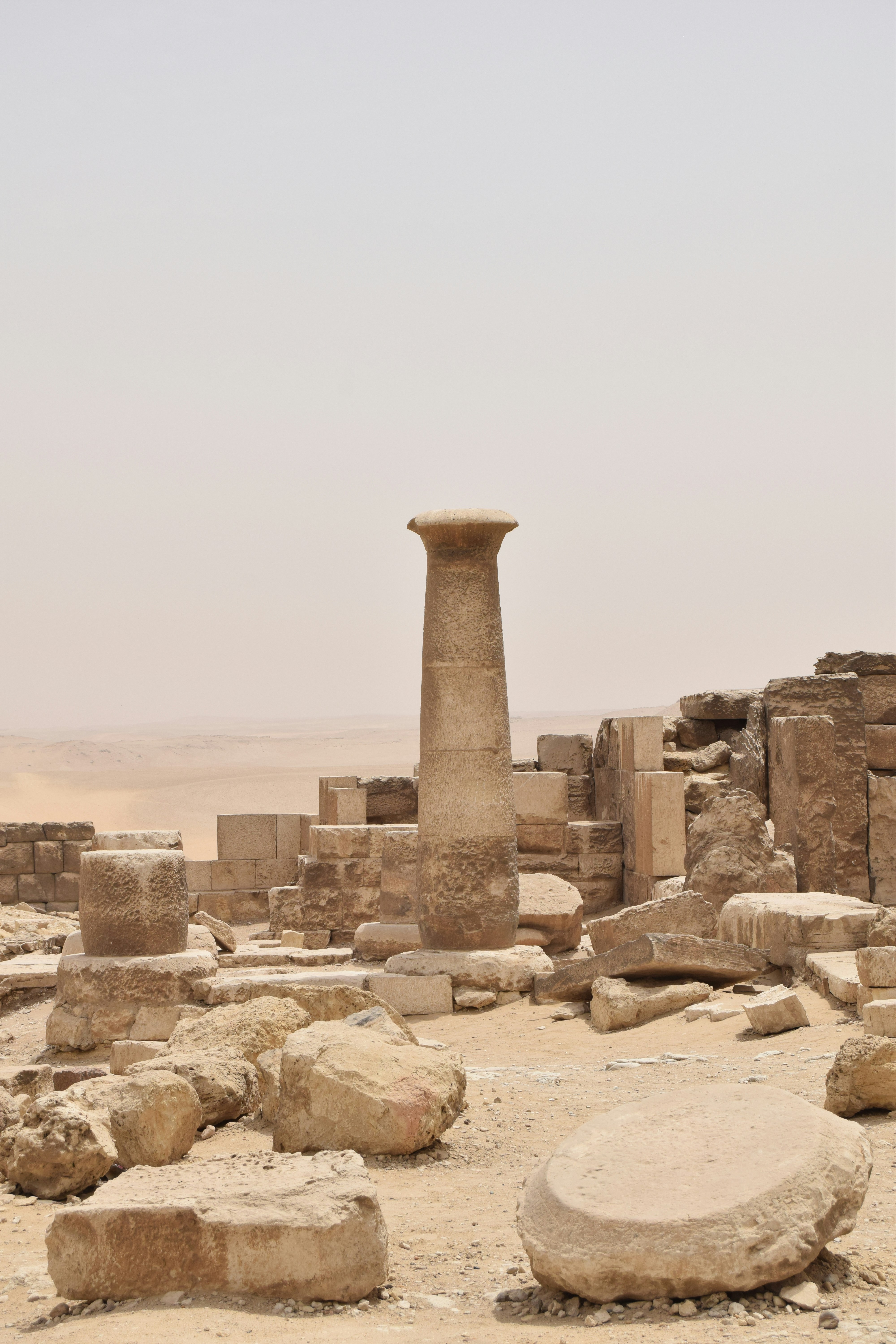 A stone structure with a tall column photo – Free Pyramids of giza ...