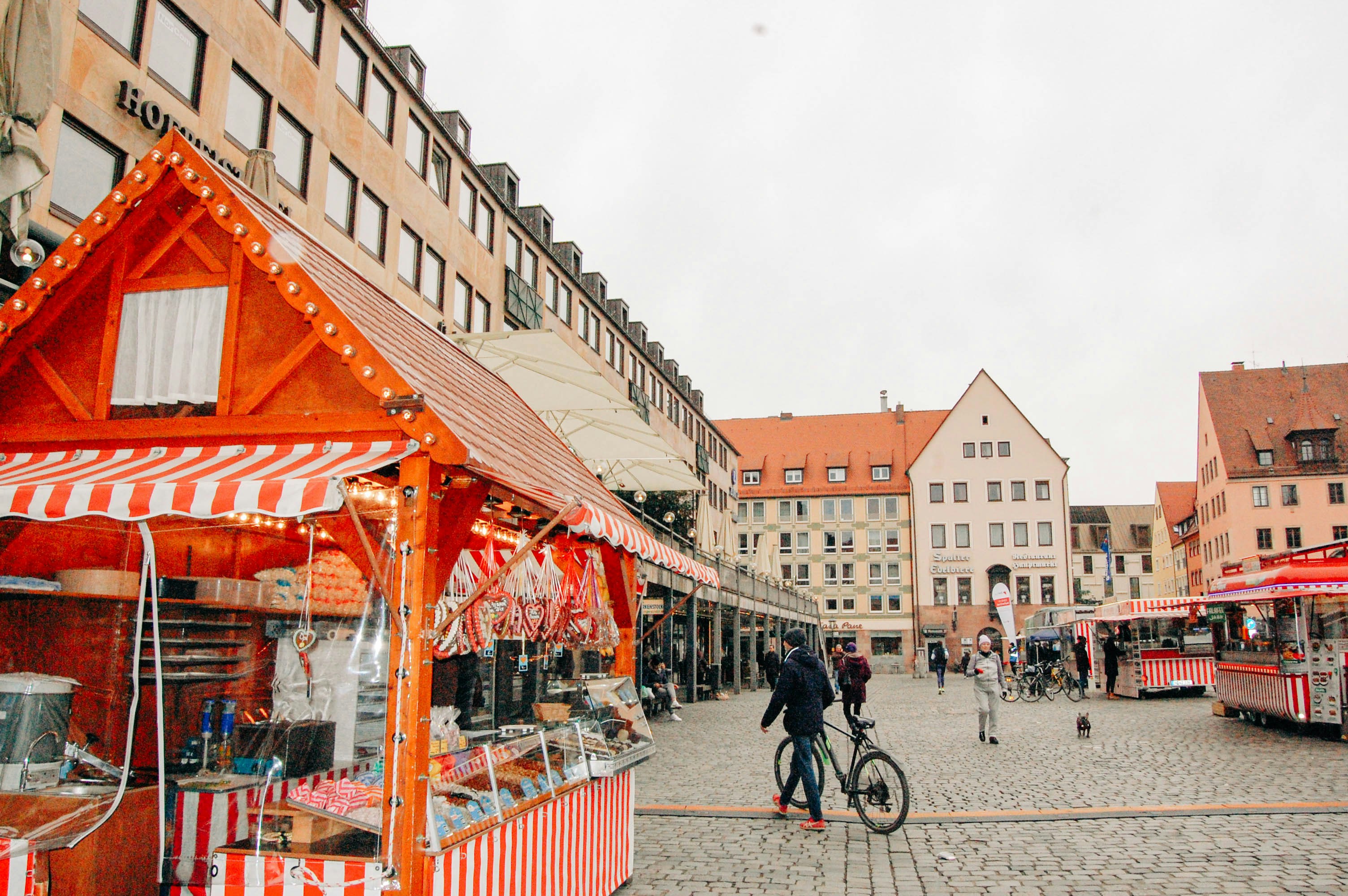 A group of people walking around a city photo – Free Human Image on ...