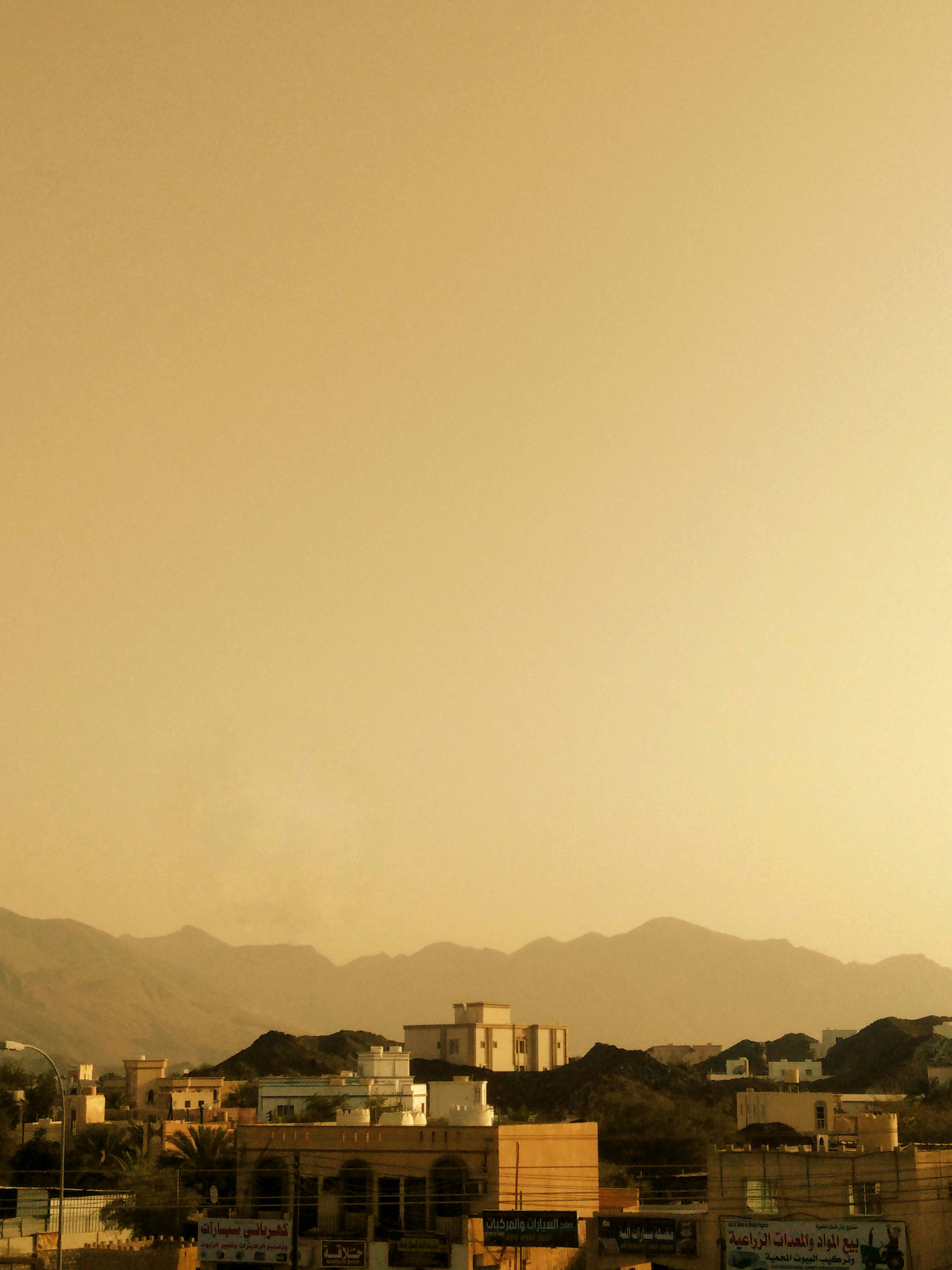 a city with mountains in the background