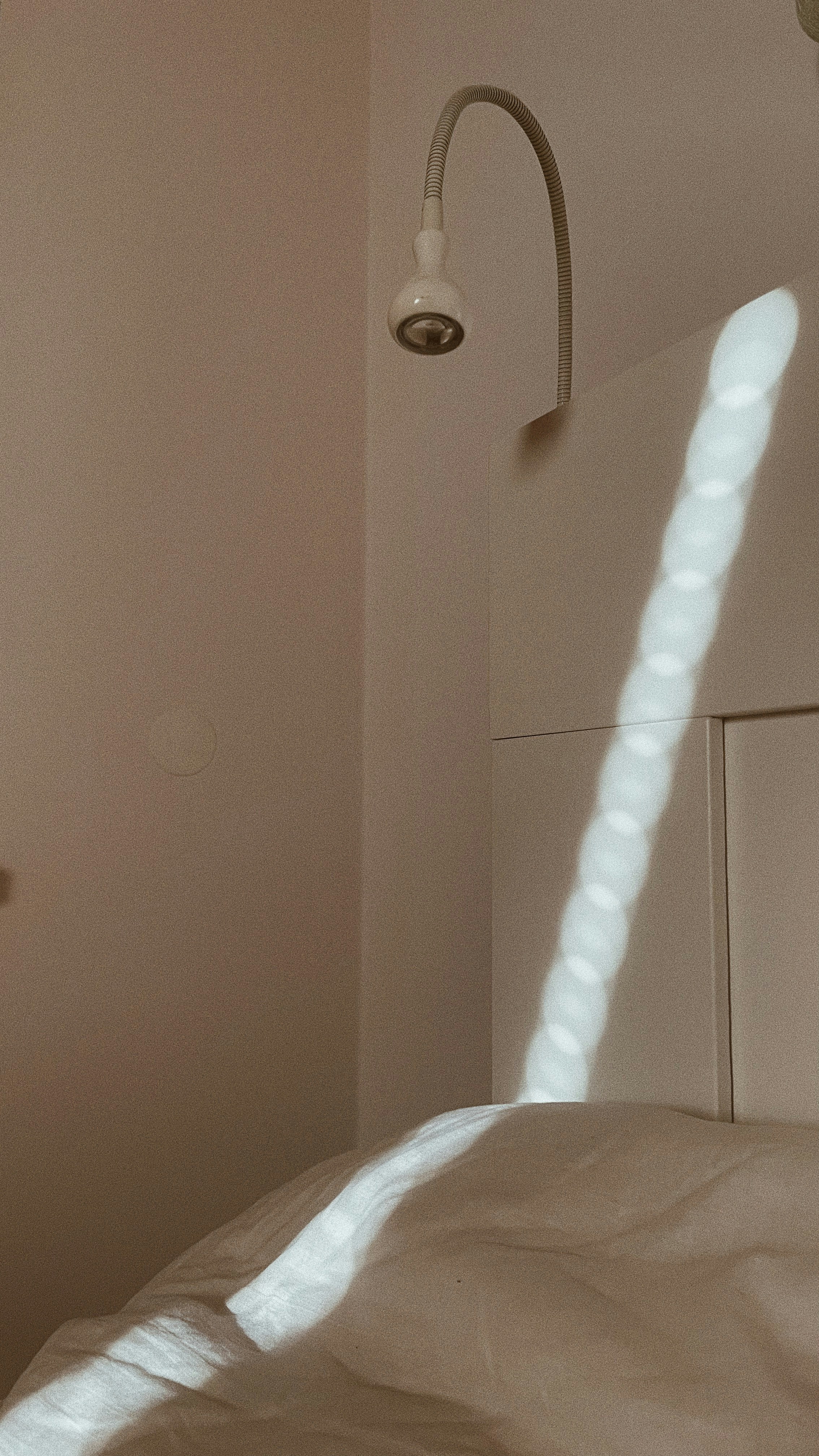 Beaded Light Across a Quiet Bedroom