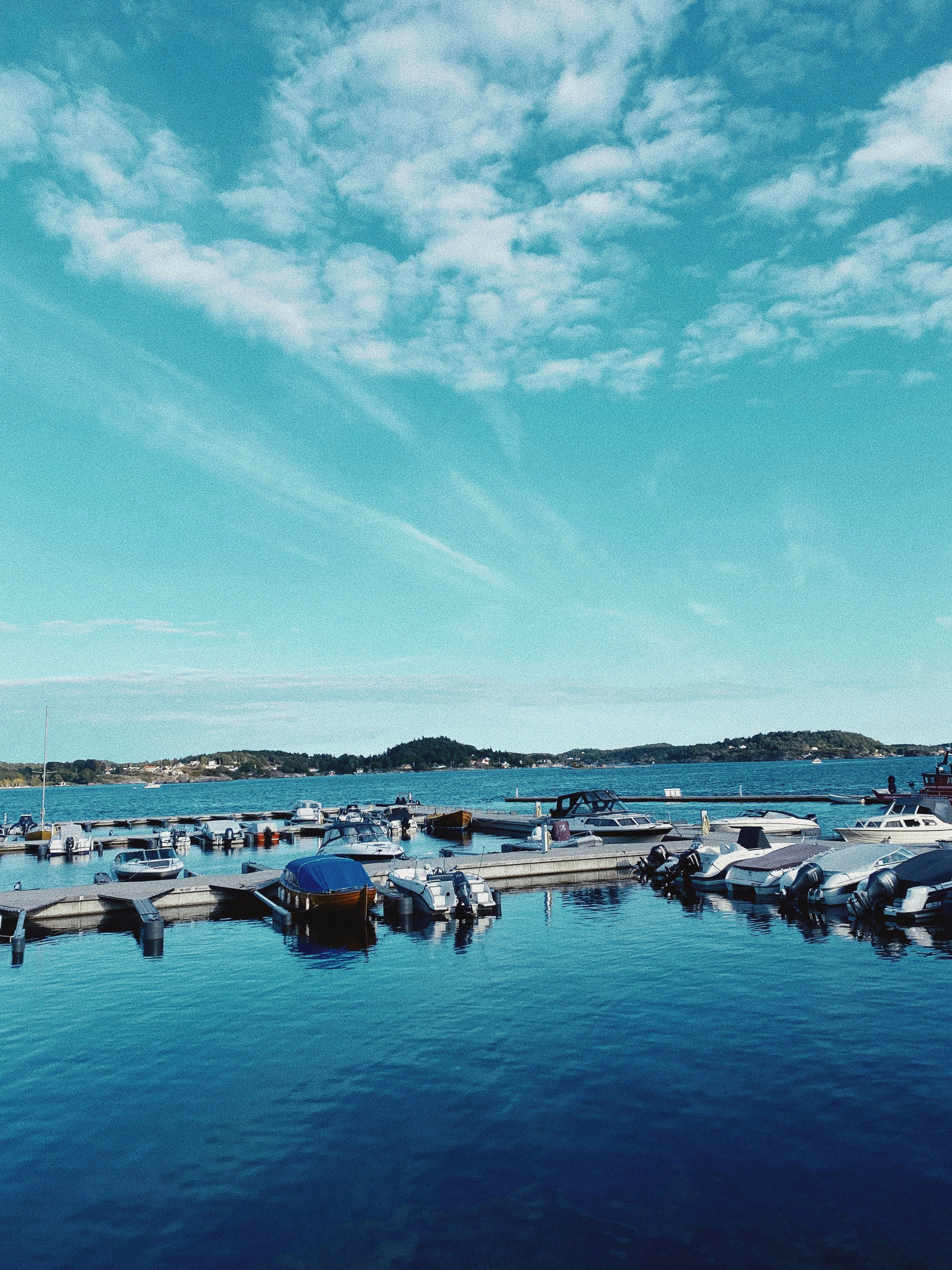 Blue Harbor Mosaic: Boats Moored at a Tranquil Marina
