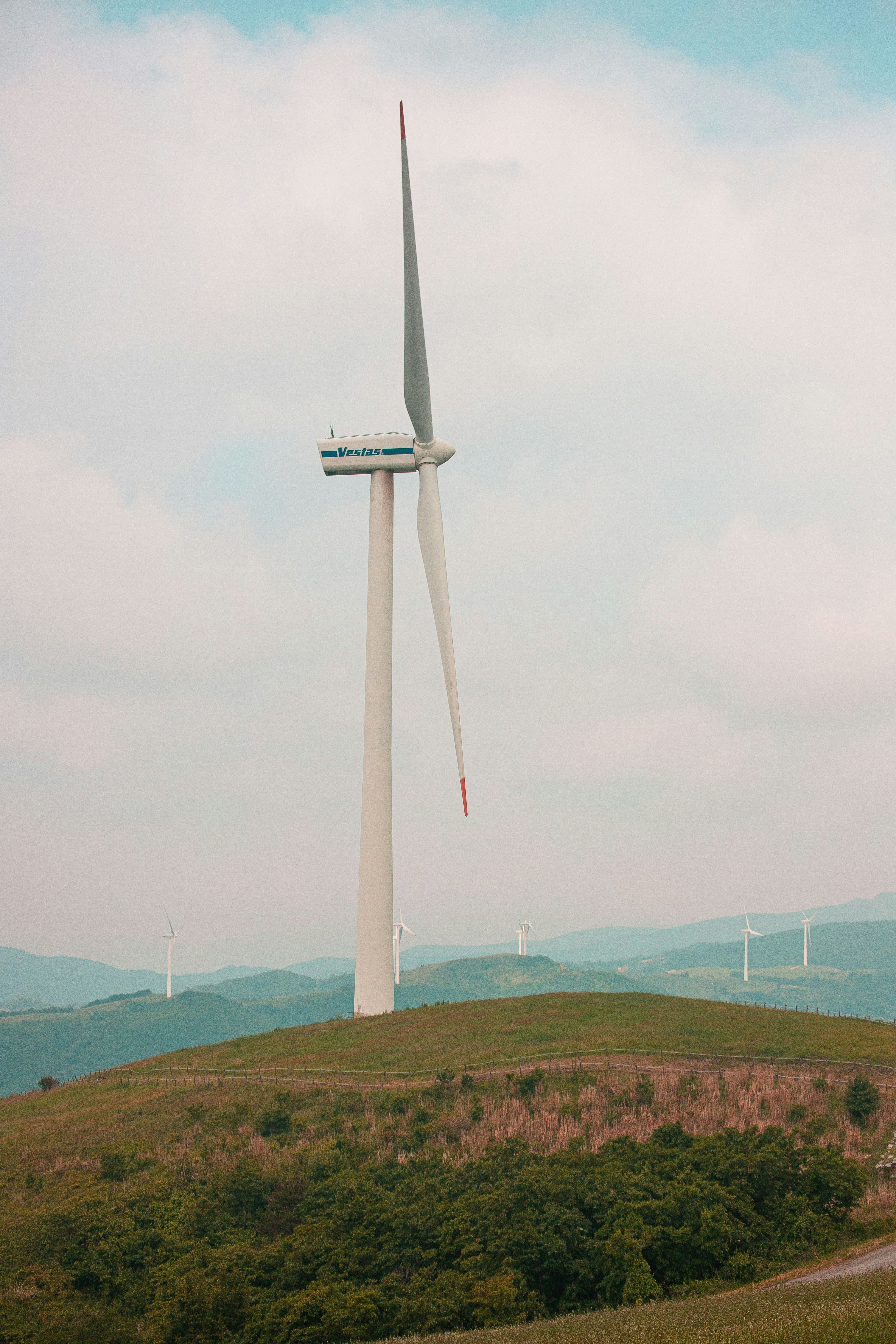 Pastel Skies Over a Wind Farm: Quiet Giants on the Crest