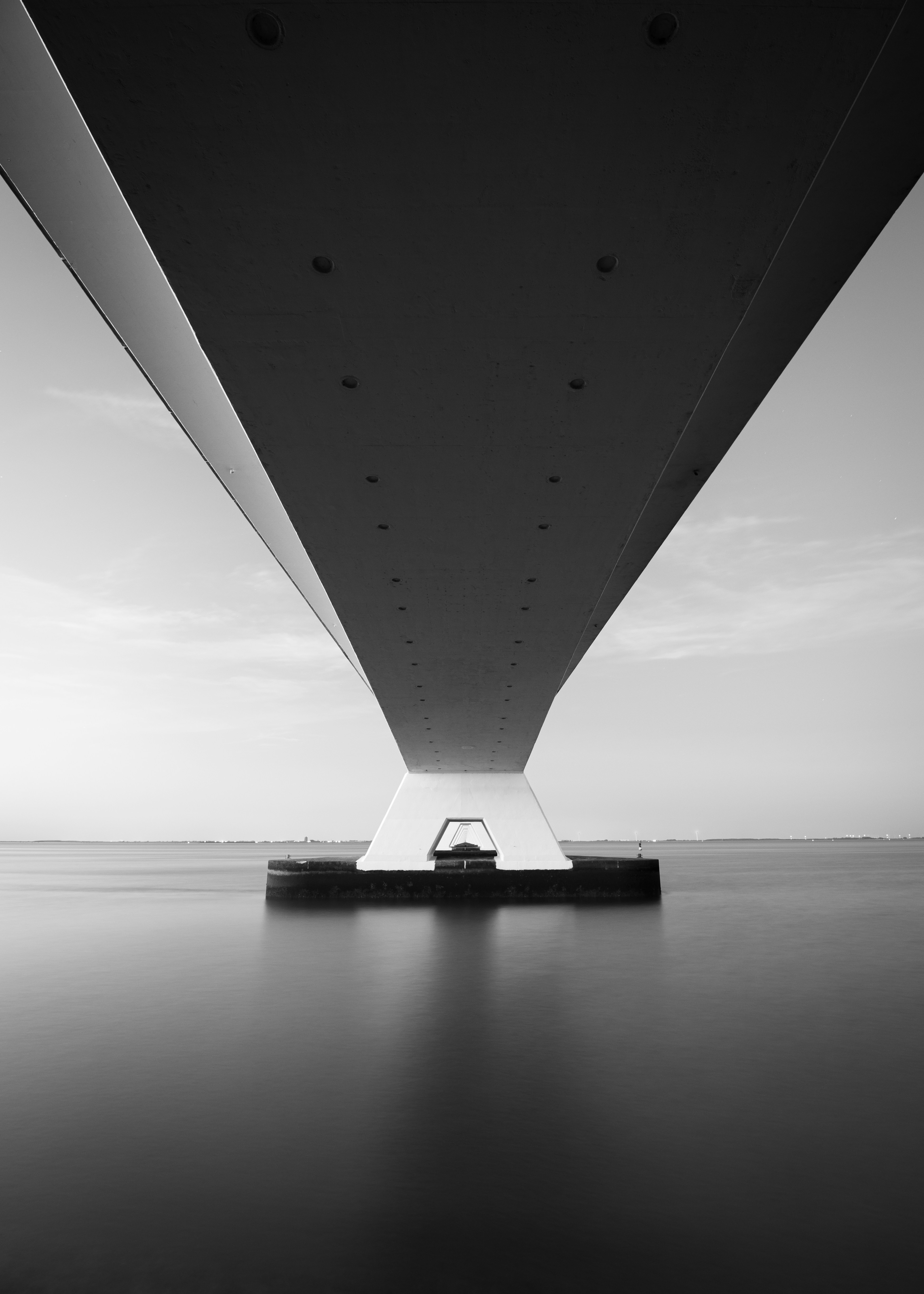 Underbridge Monolith: Geometry Rising from Calm Waters