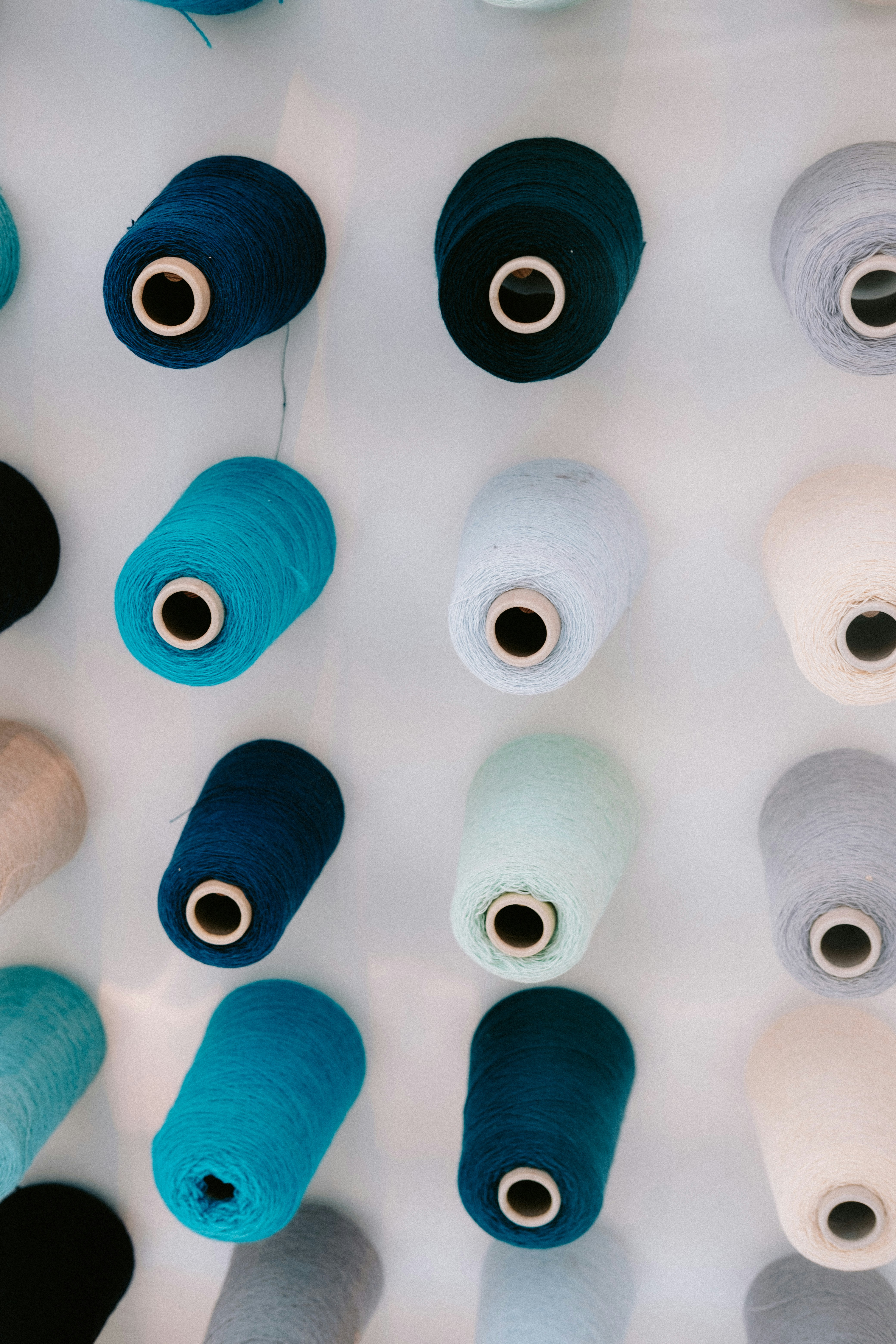Threads of Color: A Grid of Velvet Spools