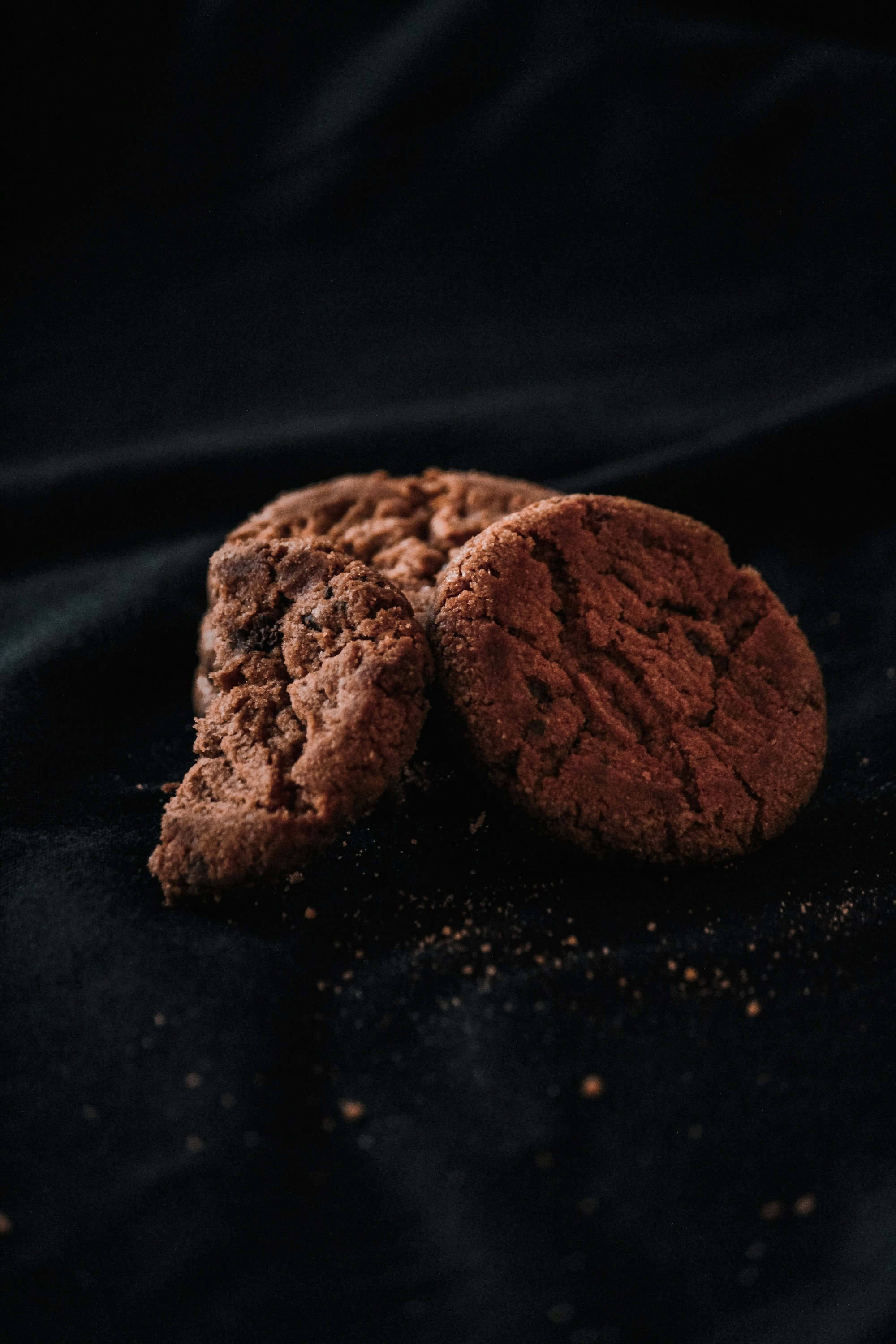 A couple of brown objects on a black surface photo – Free Brown Image ...