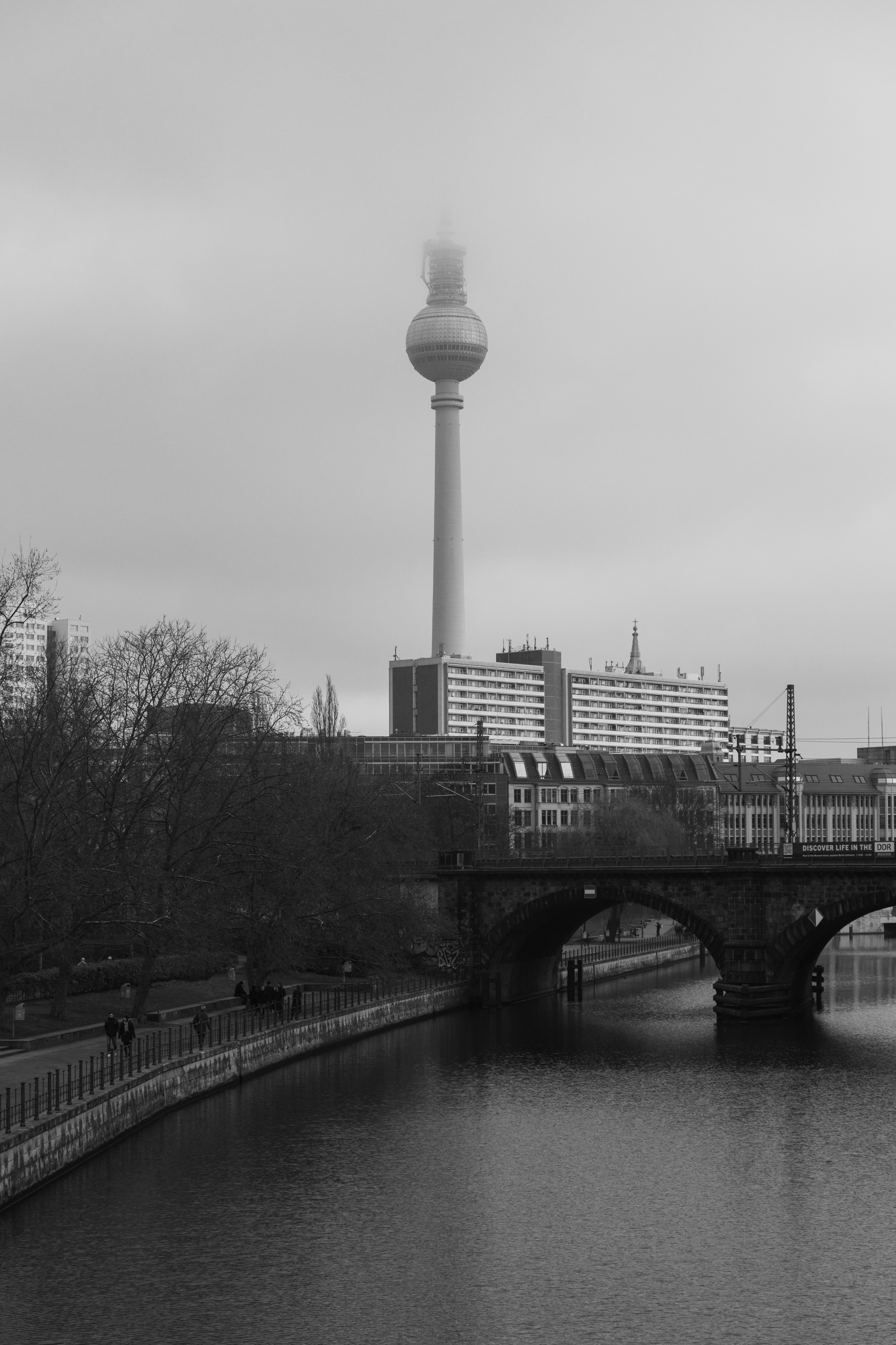Mist-High Beacon: Berlin's Fernsehturm Rising Over the Spree
