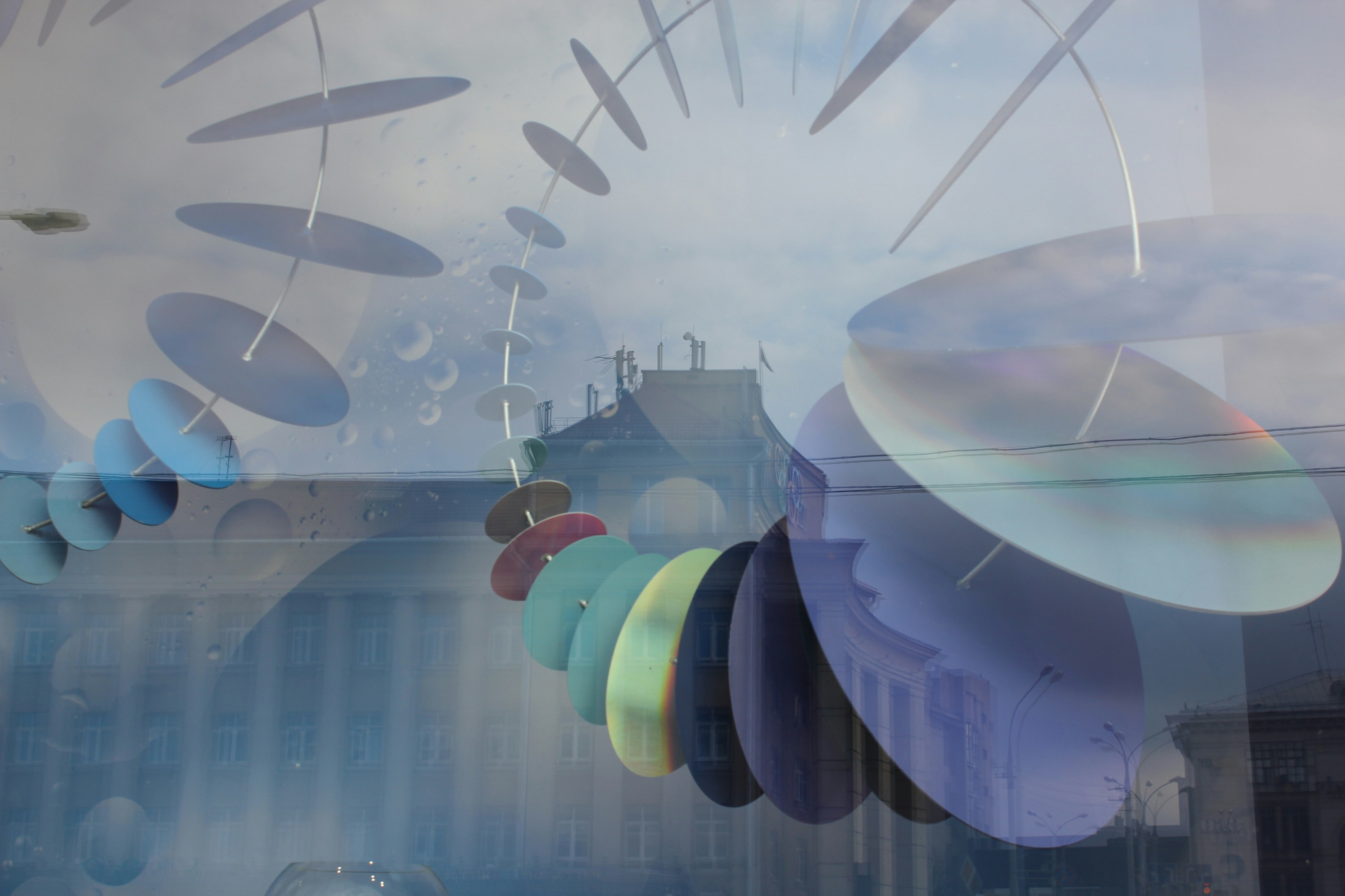 Chromatic Orbits on a Glass City Facade