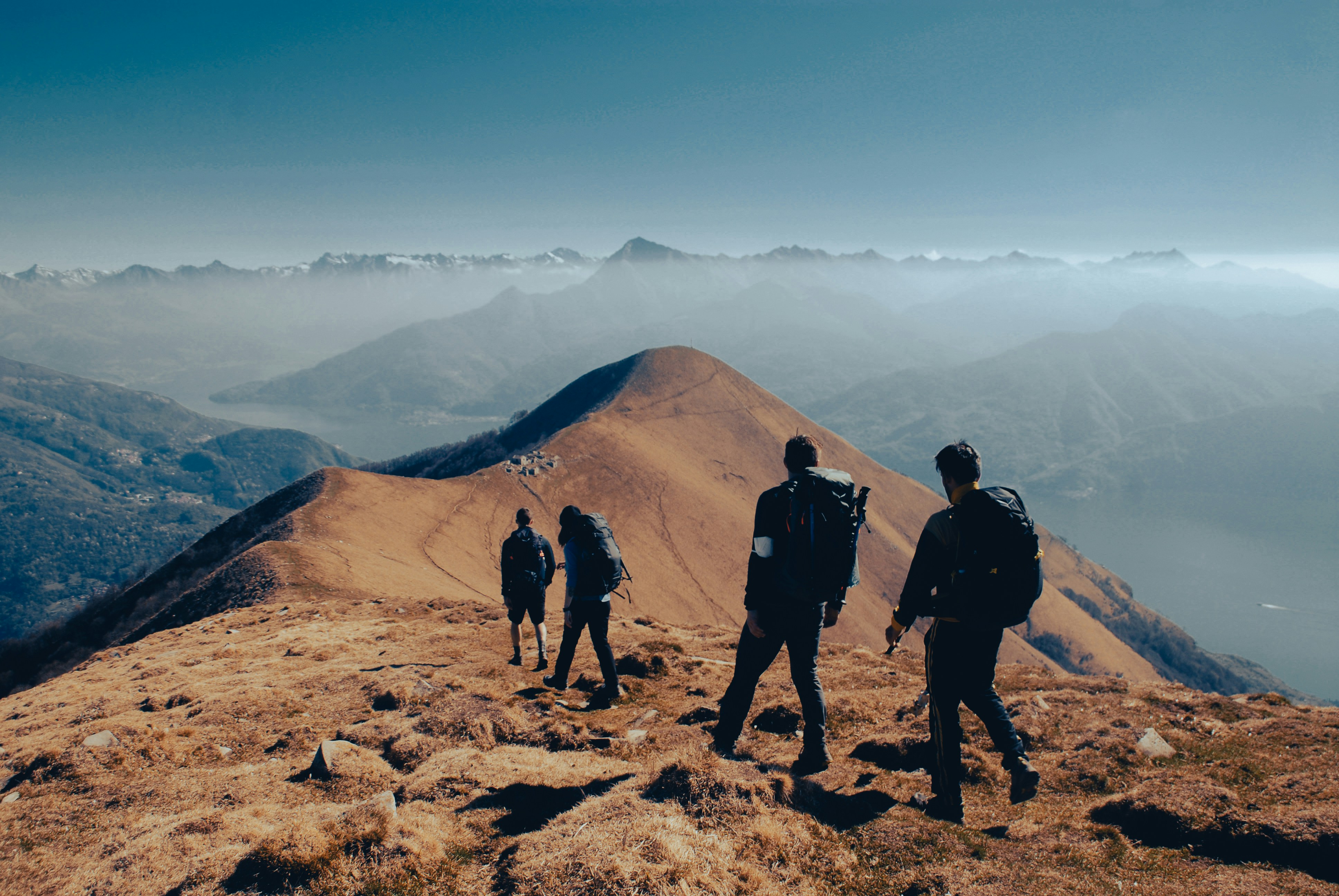 A group of people walking up a mountain photo – Free Italy Image on ...