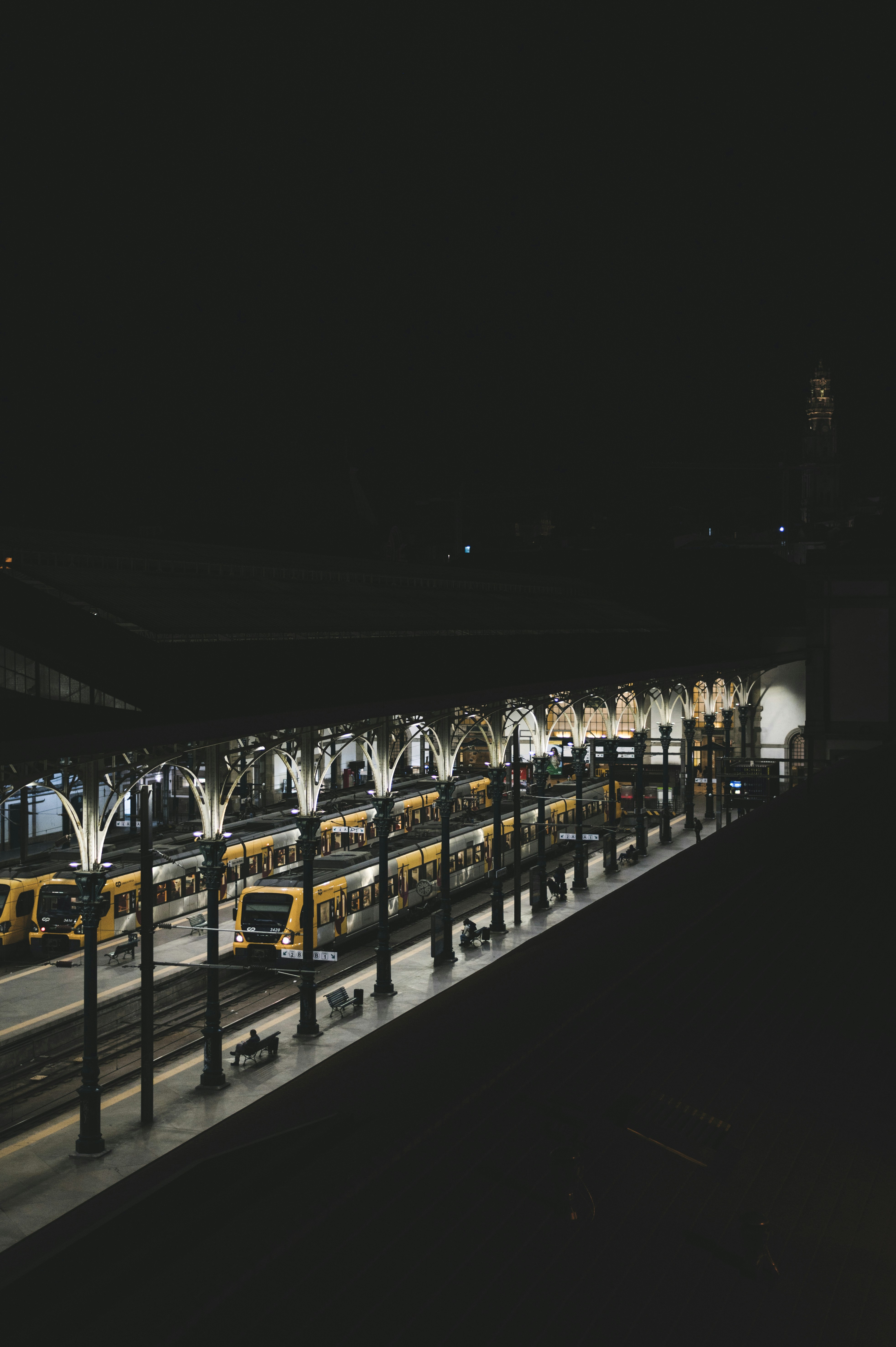 Night Train Concourse: A Quiet Platform Among Illuminated Arches