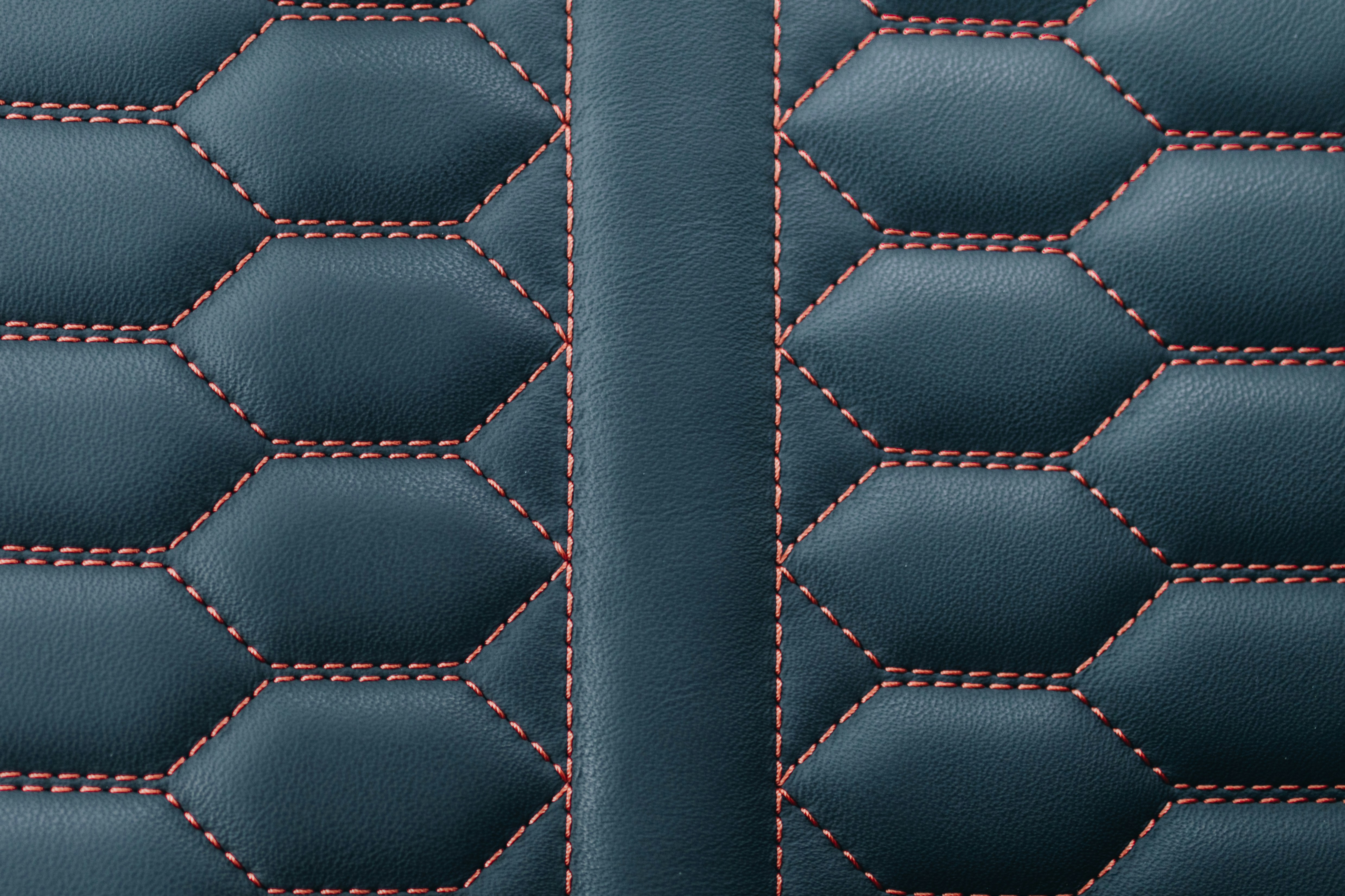 Hex-Tiled Blue Leather: Red Stitching Along a Central Seam