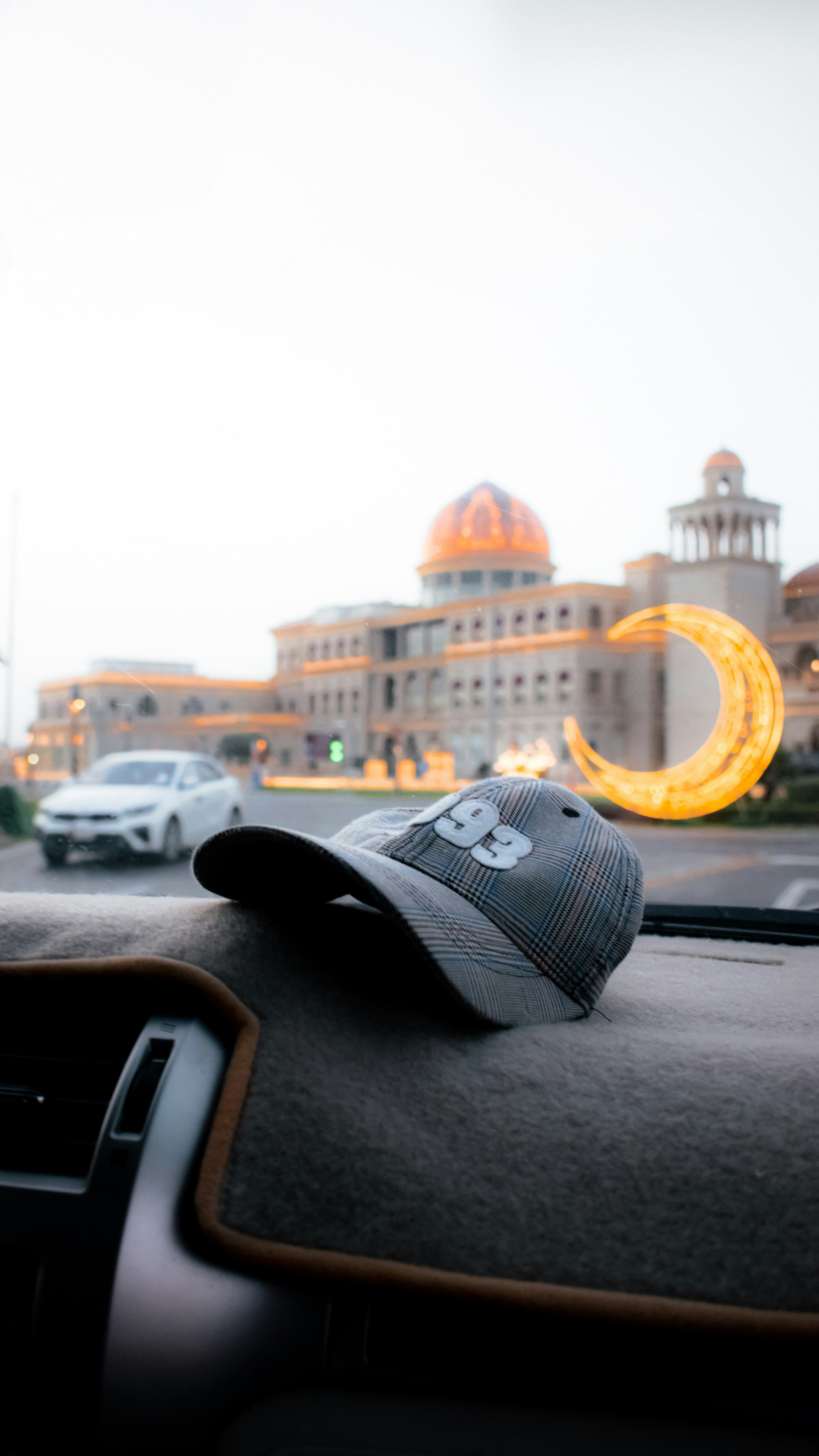 Hat on the dash: neon crescent and domed campus glow