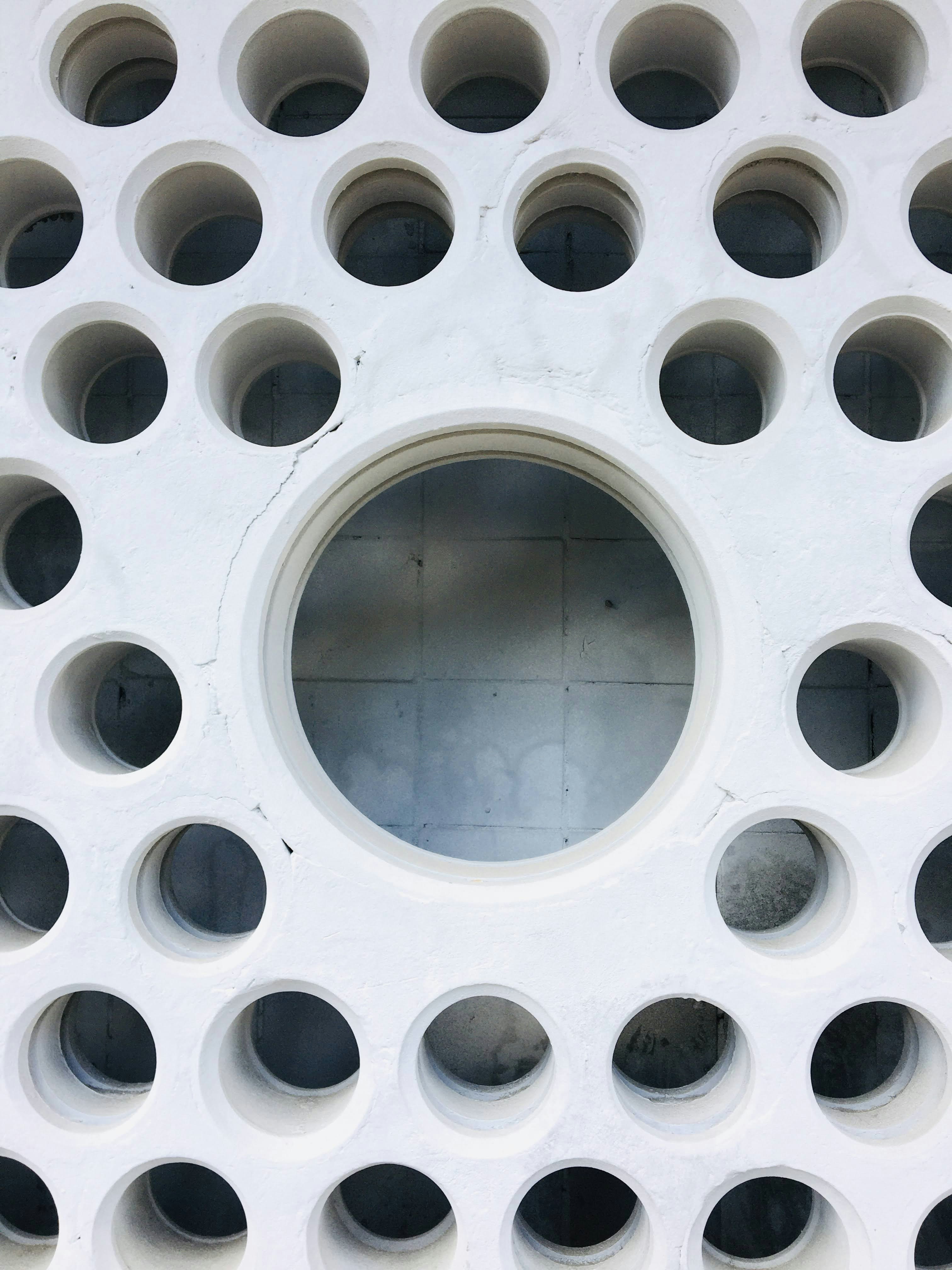 A white circular object with holes photo – Free Grey Image on Unsplash