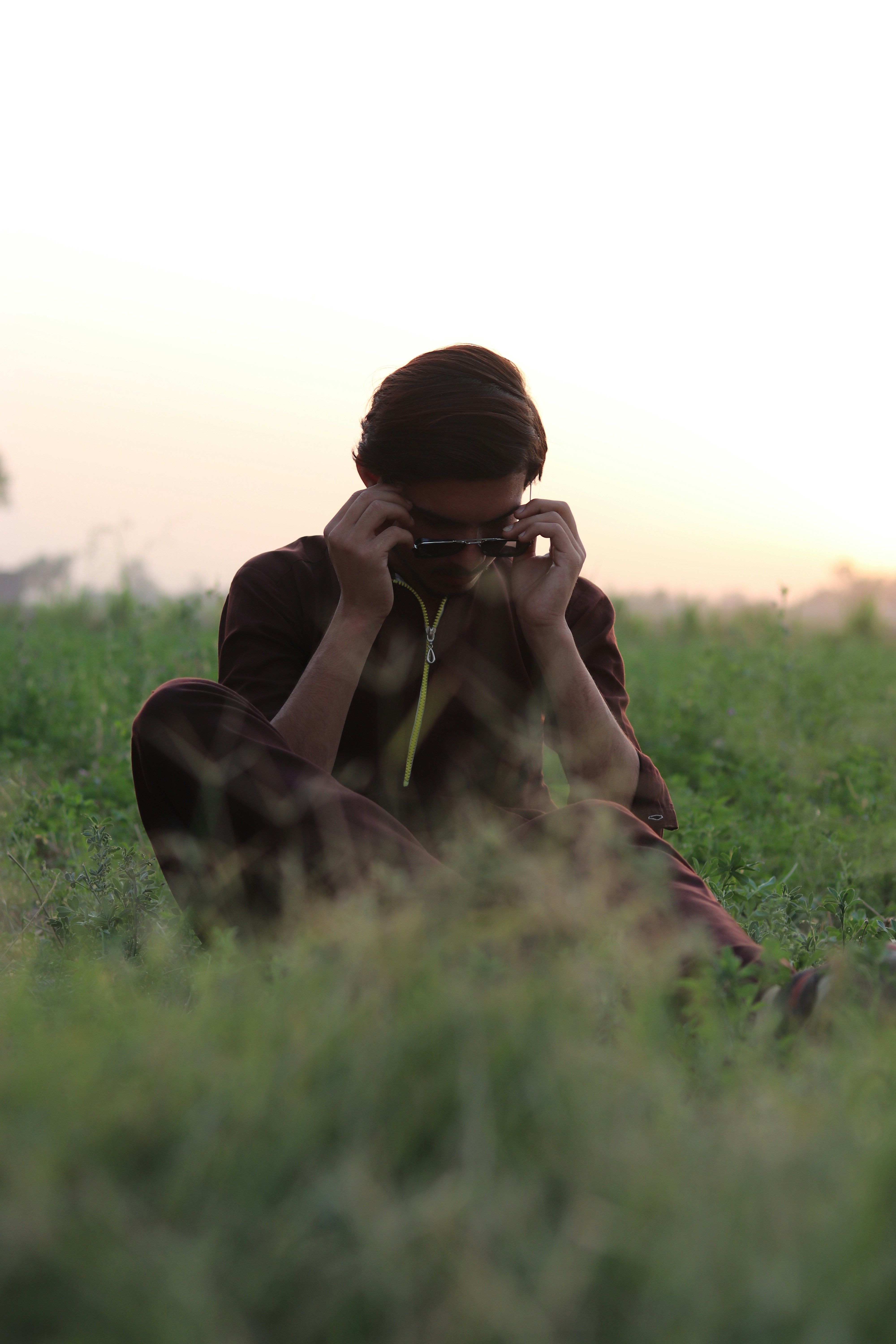 Sunset Quiet: A Meditative Portrait in Grassy Field
