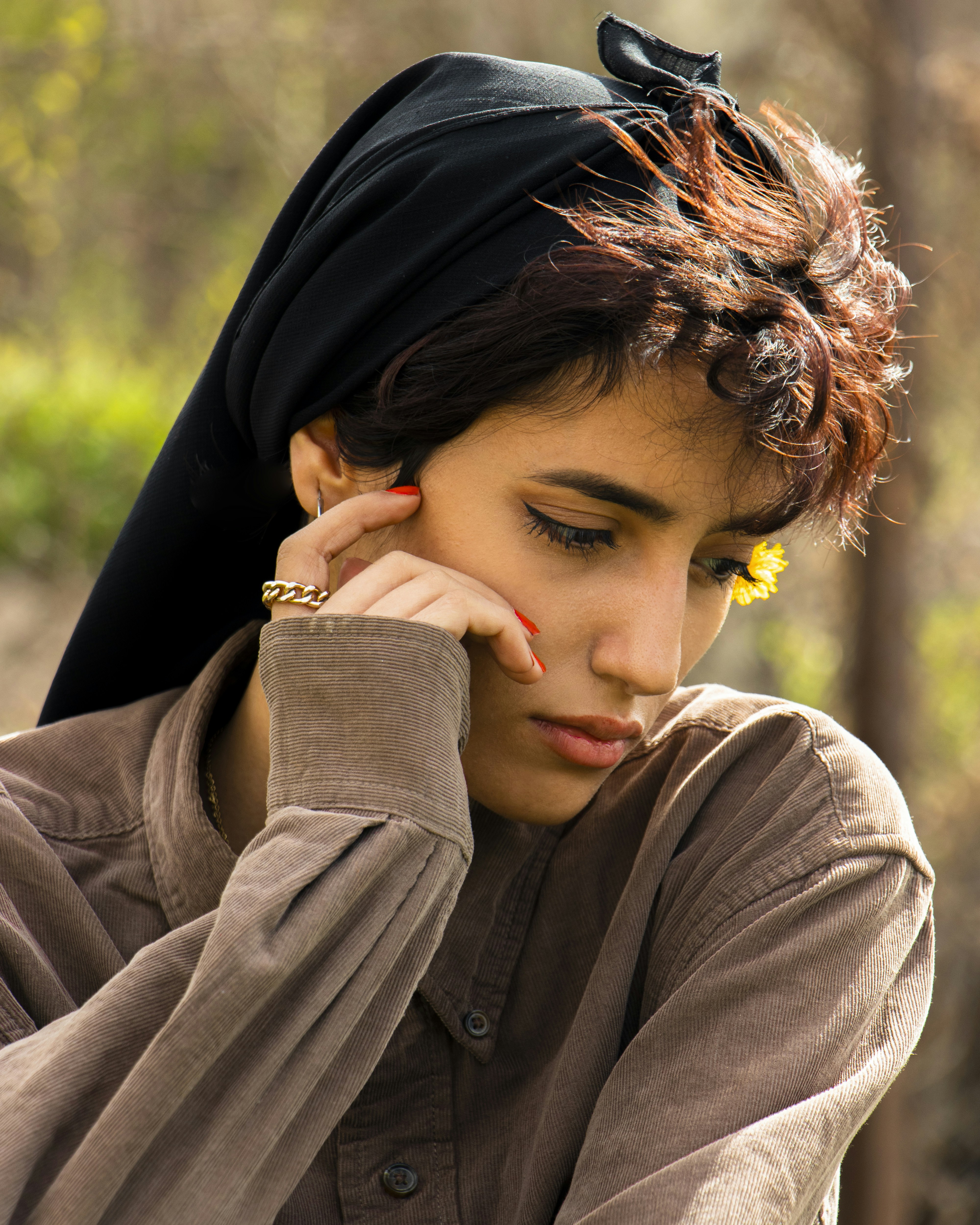 Amber Light and Quiet Contemplation: Portrait Under a Black Veil