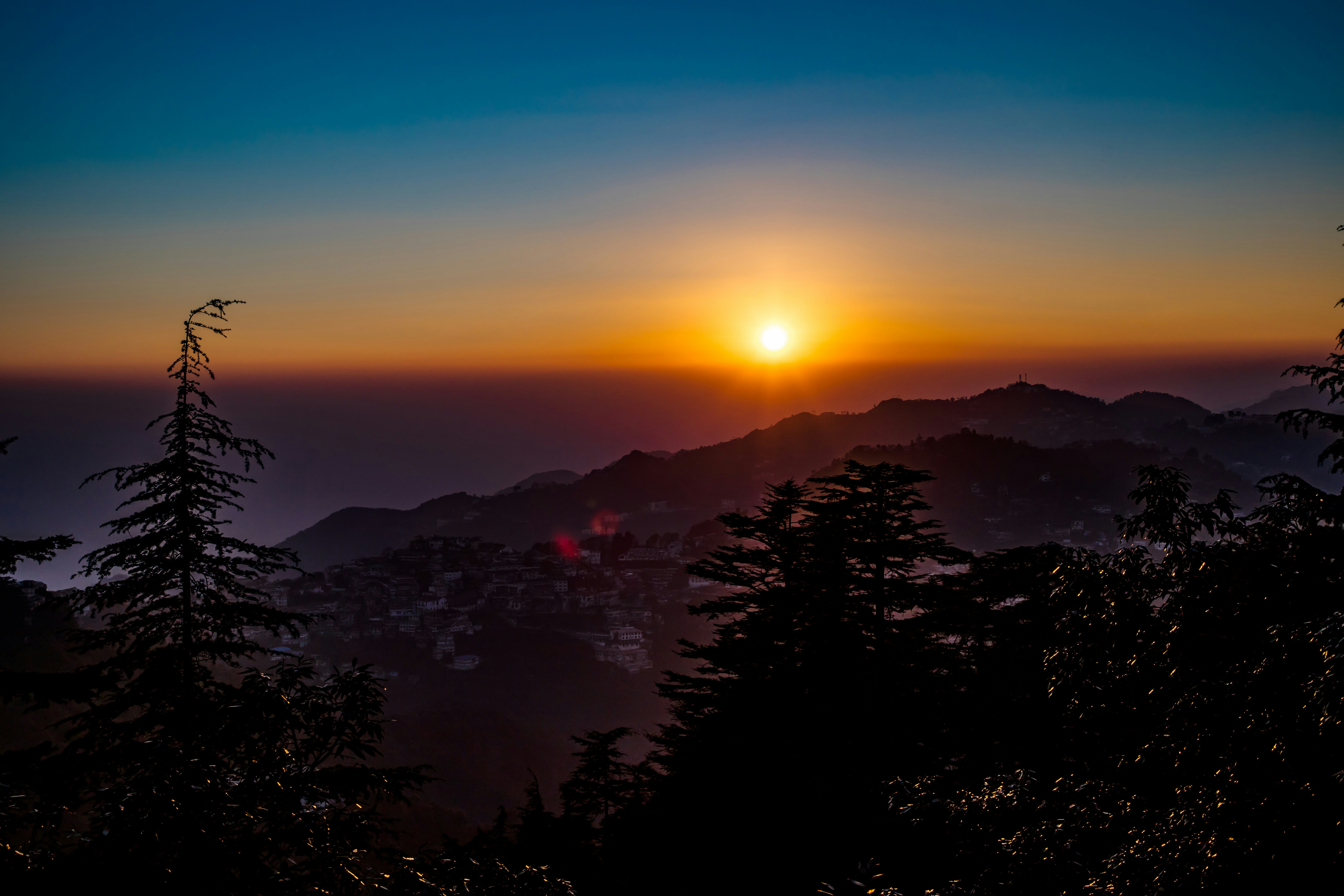 A sunset over a mountain range photo – Free Mussoorie Image on Unsplash