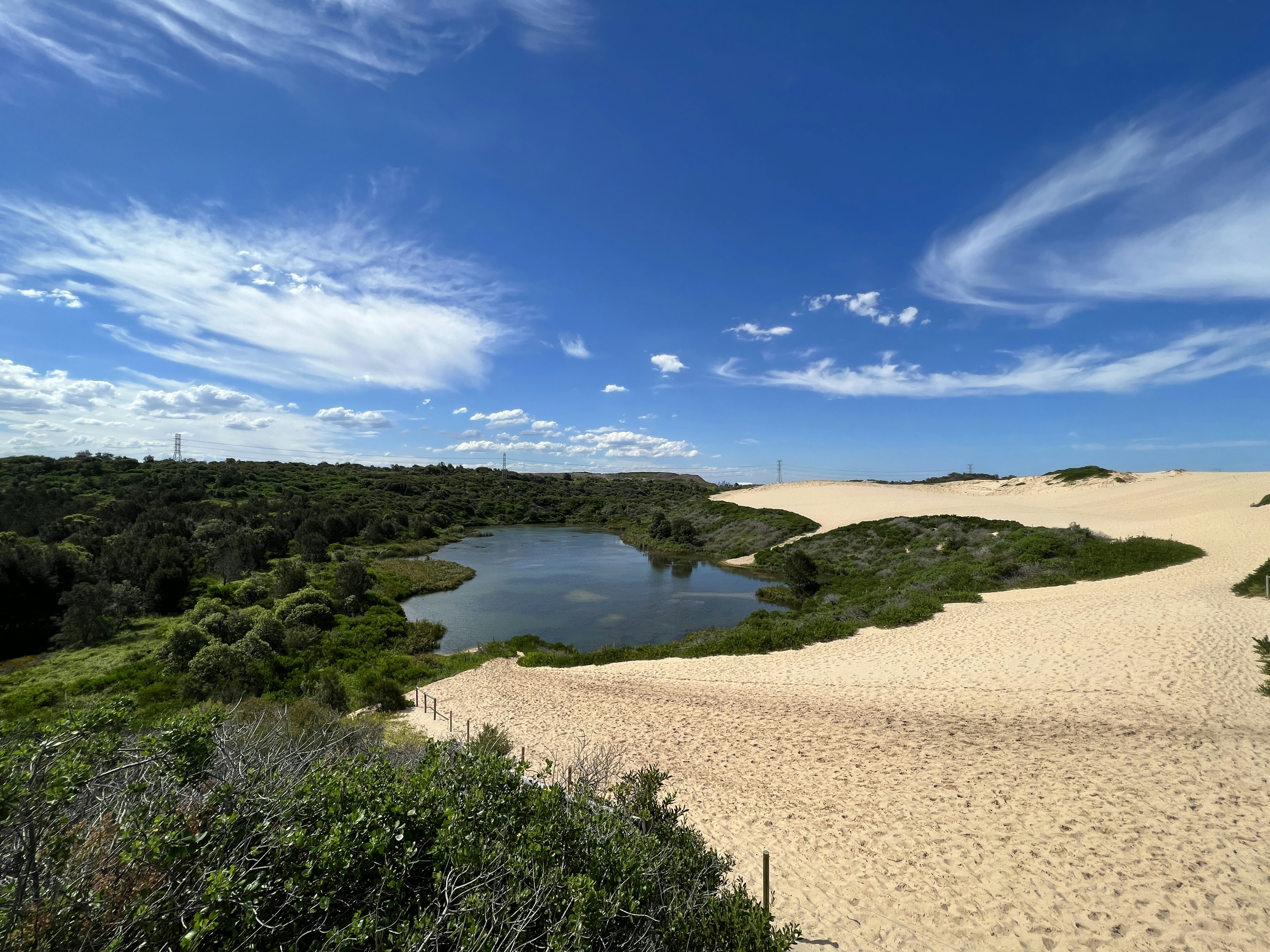 a river running through a sandy area