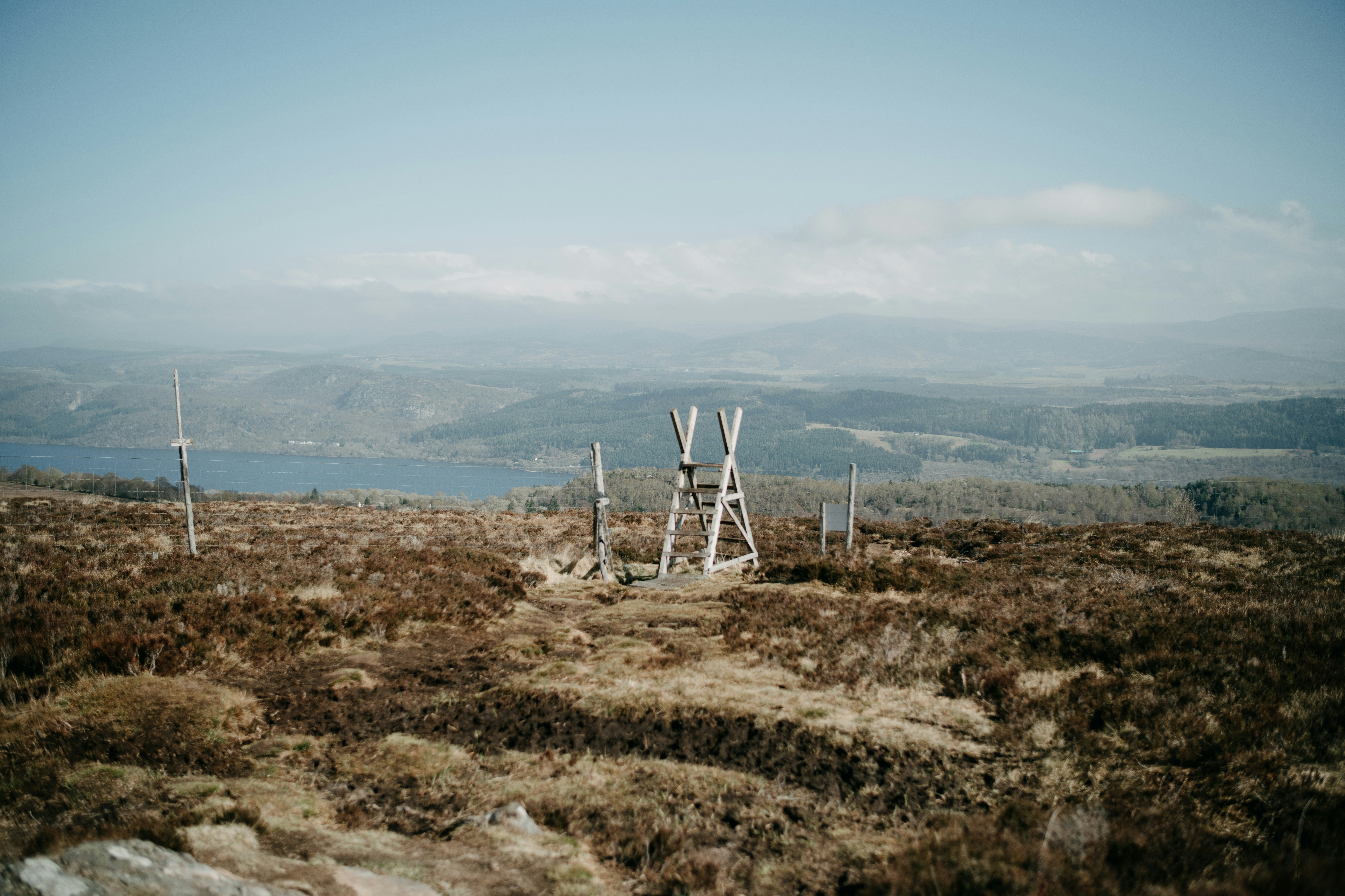 Vast Moor with Weathered Structures Beneath a Quiet Horizon