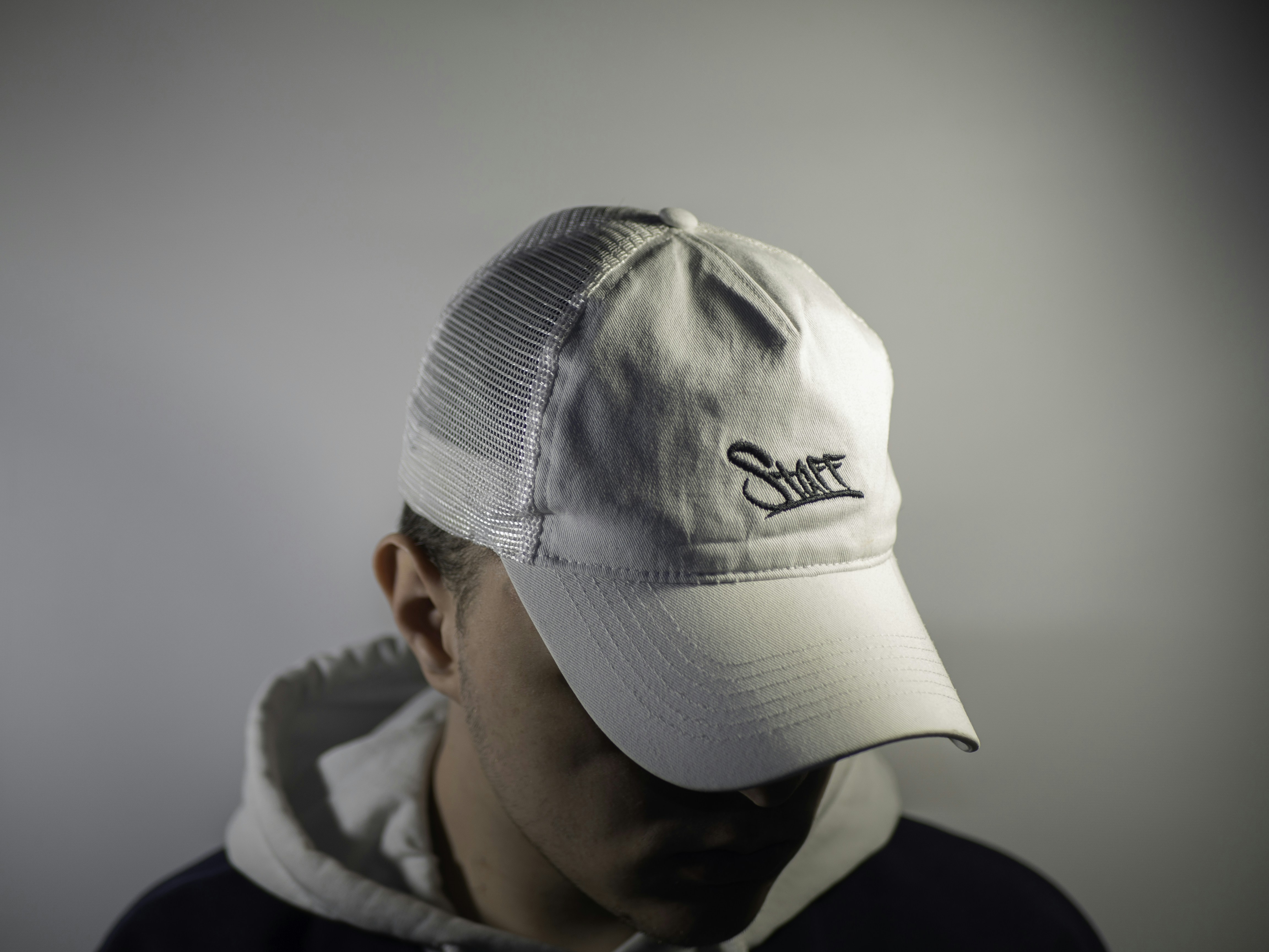 Caps and Quiet Mood: A Portrait in Soft Light
