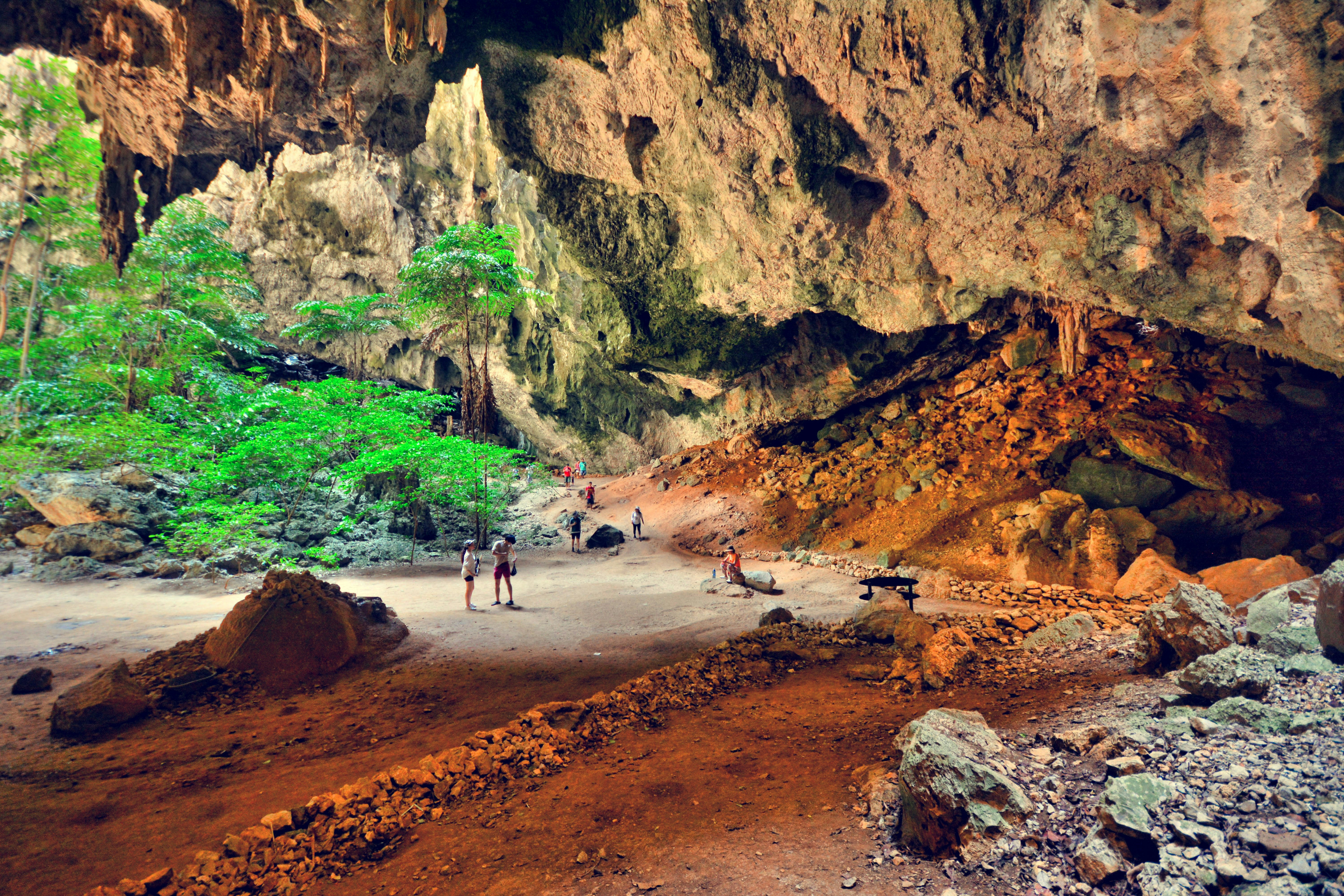 People walking in a cave photo – Free Architecture Image on Unsplash