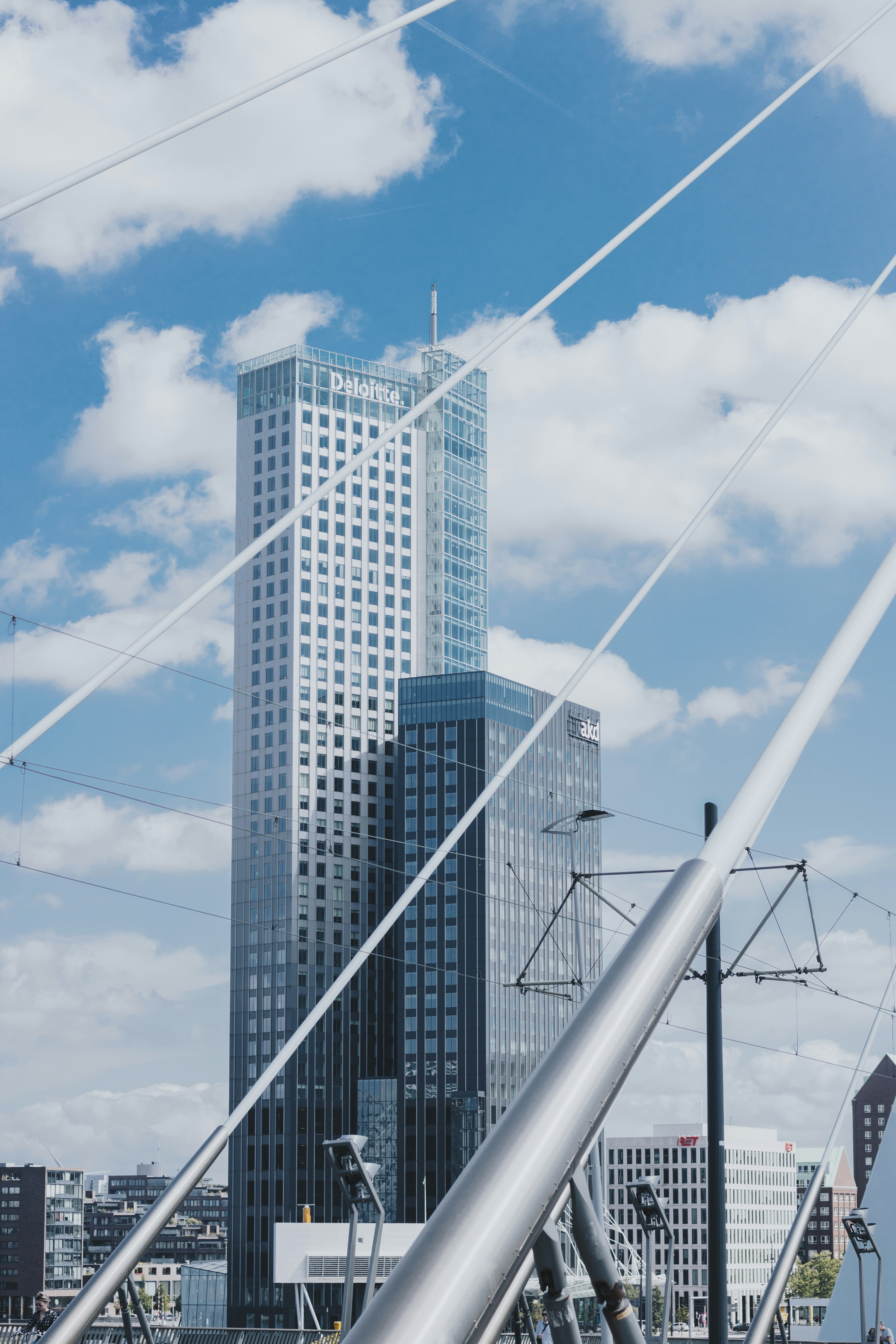 A tall building with a bridge photo – Free Rotterdam Image on Unsplash