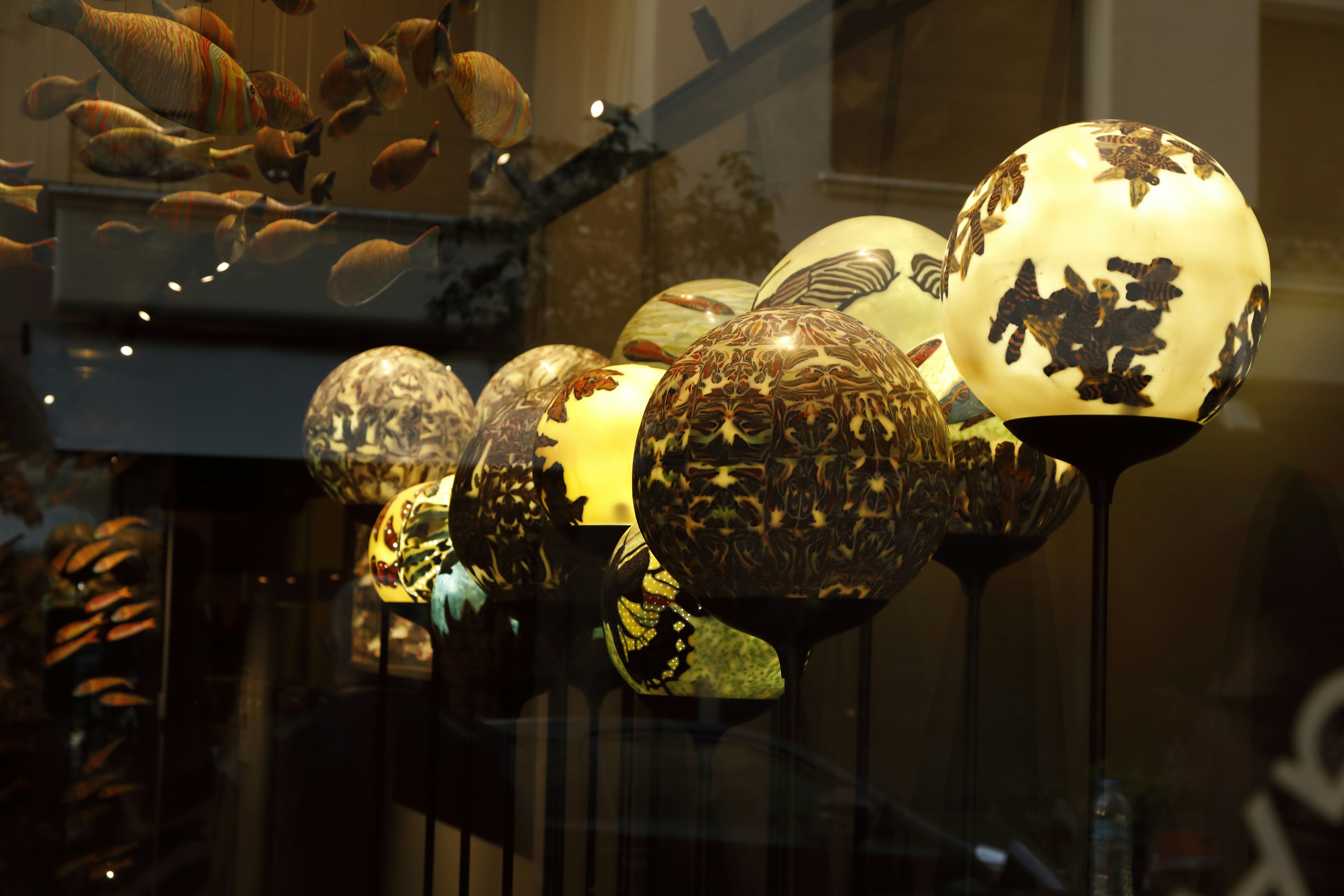 Luminous Orb Garden: Narrative Lamps in a Dim Shop Window