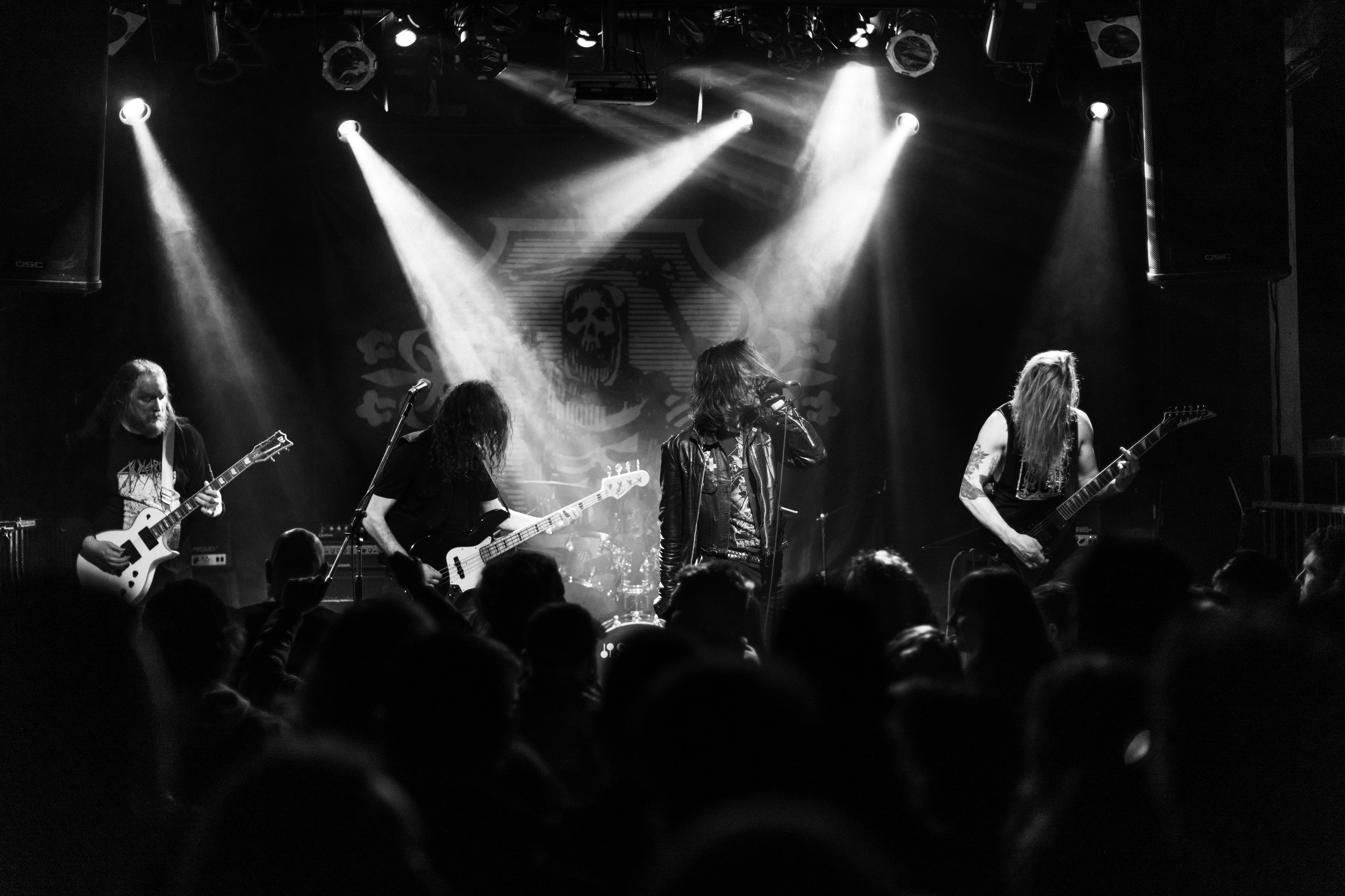 A group of people playing instruments on a stage photo – Free Grey ...