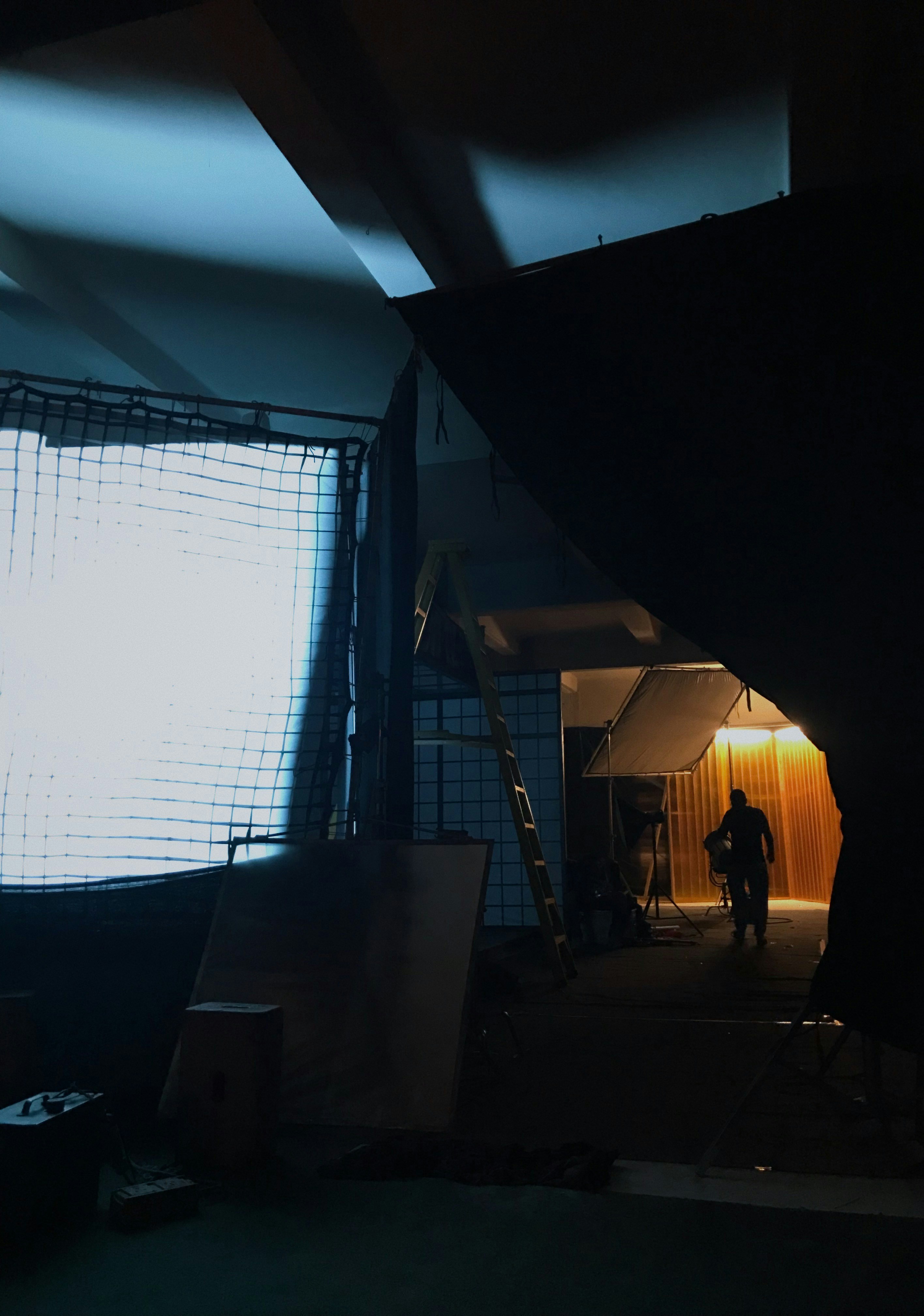 A person walking down a hall photo – Free Human Image on Unsplash