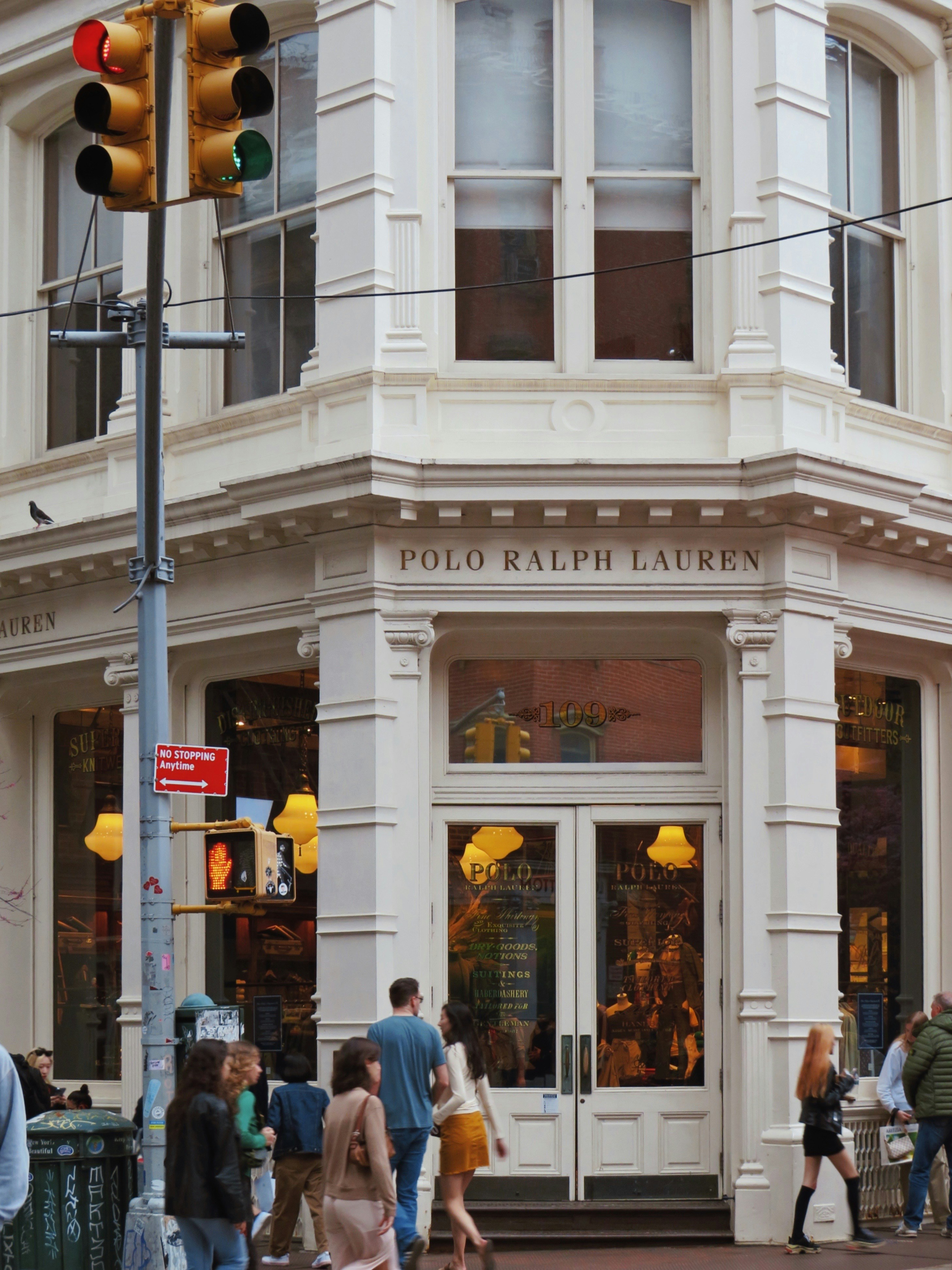 A group of people walk by a storefront photo – Free Bloomingdale's ...