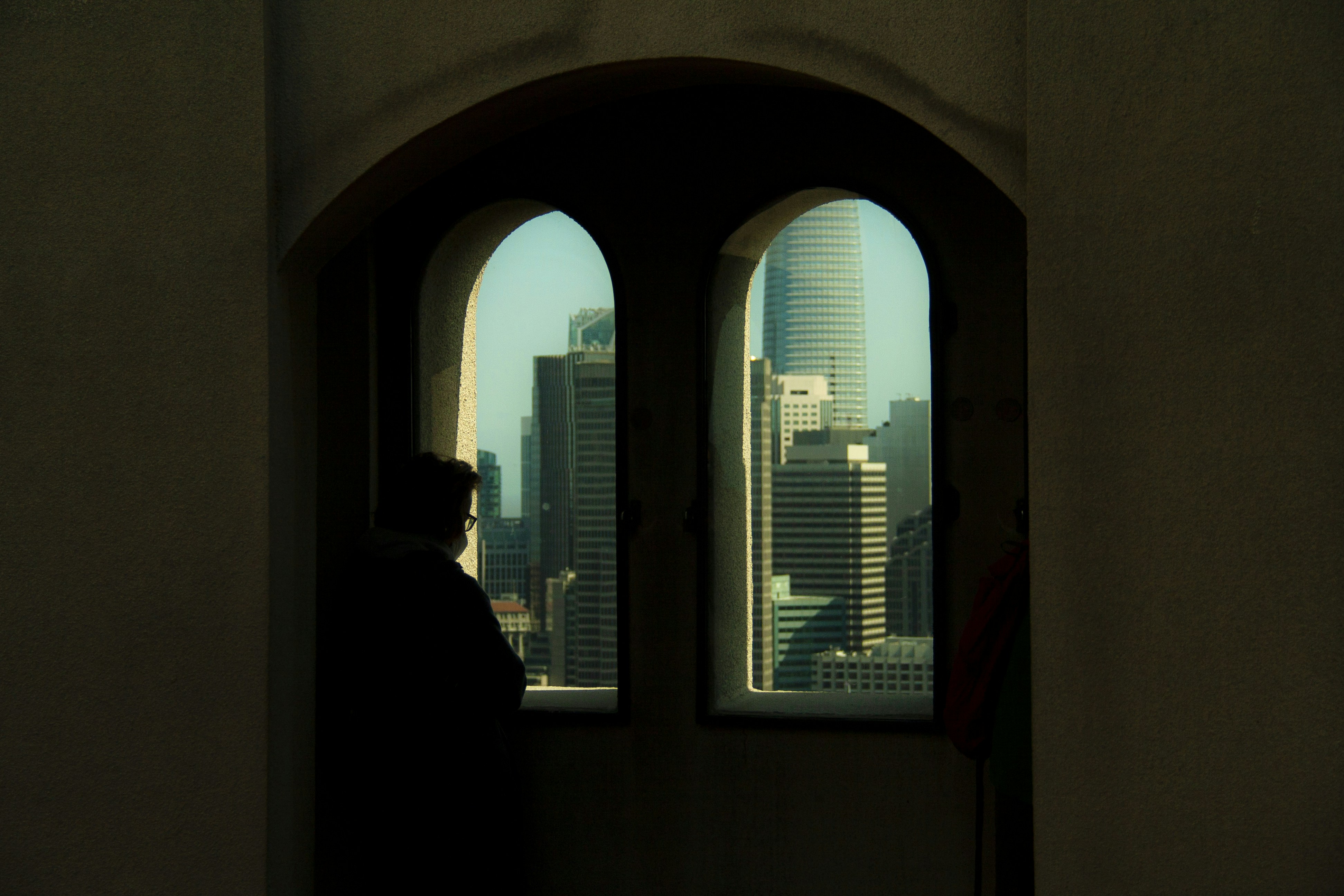 Archway Threshold: Silhouette Framing a Distant Skyline