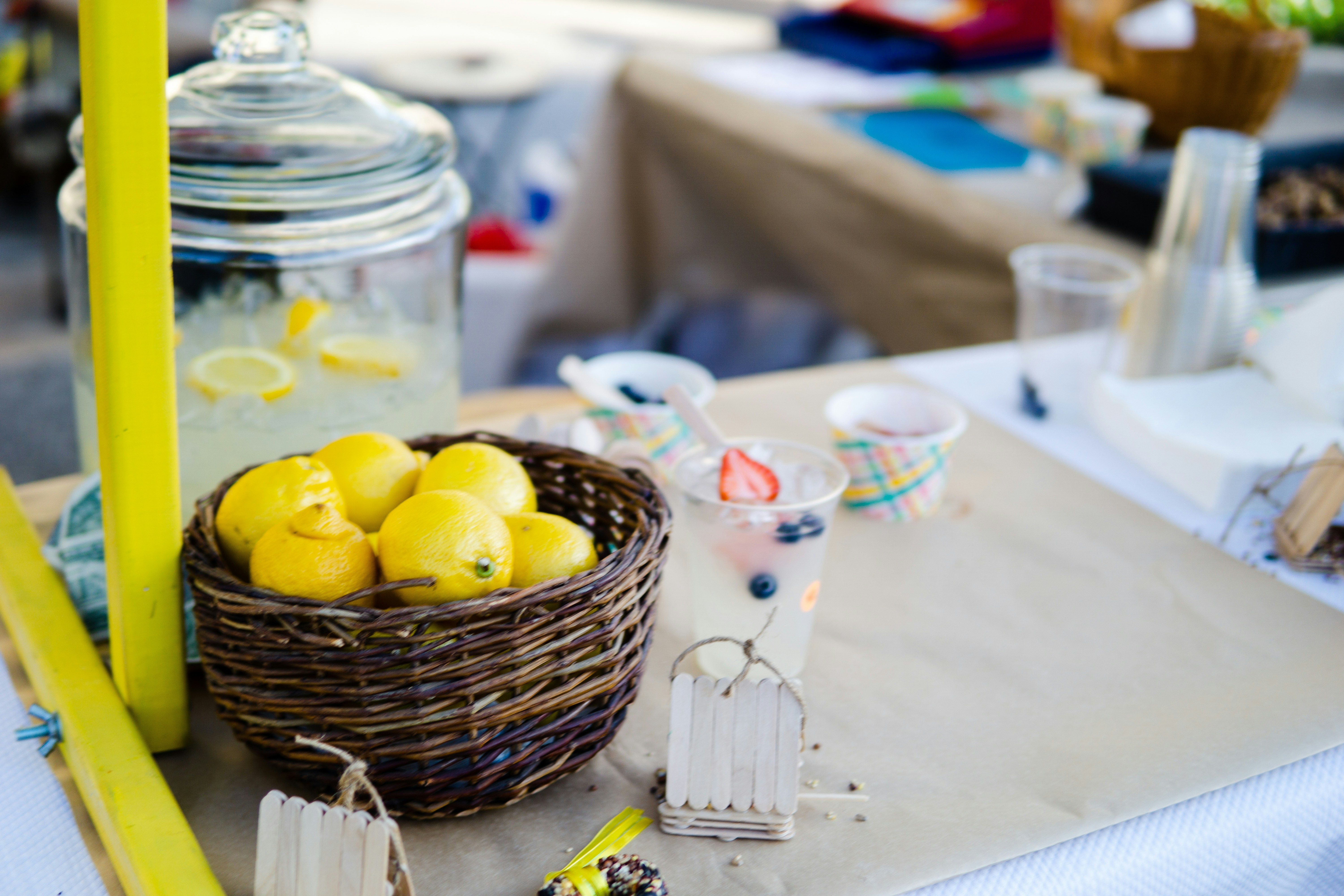 a basket of lemons on a table