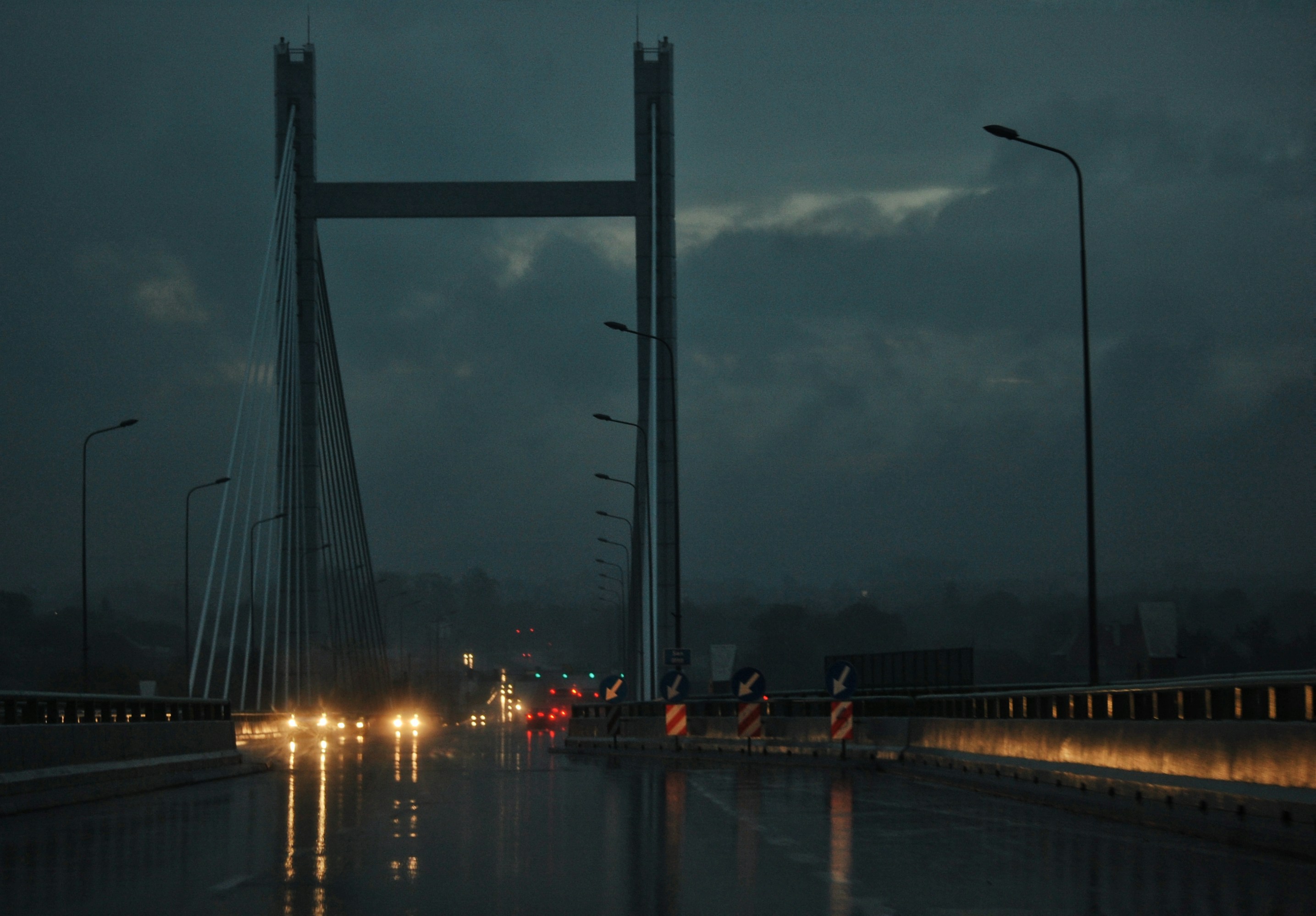 Nocturnal Suspension: Neon Reflections on a Rain-Slick Bridge