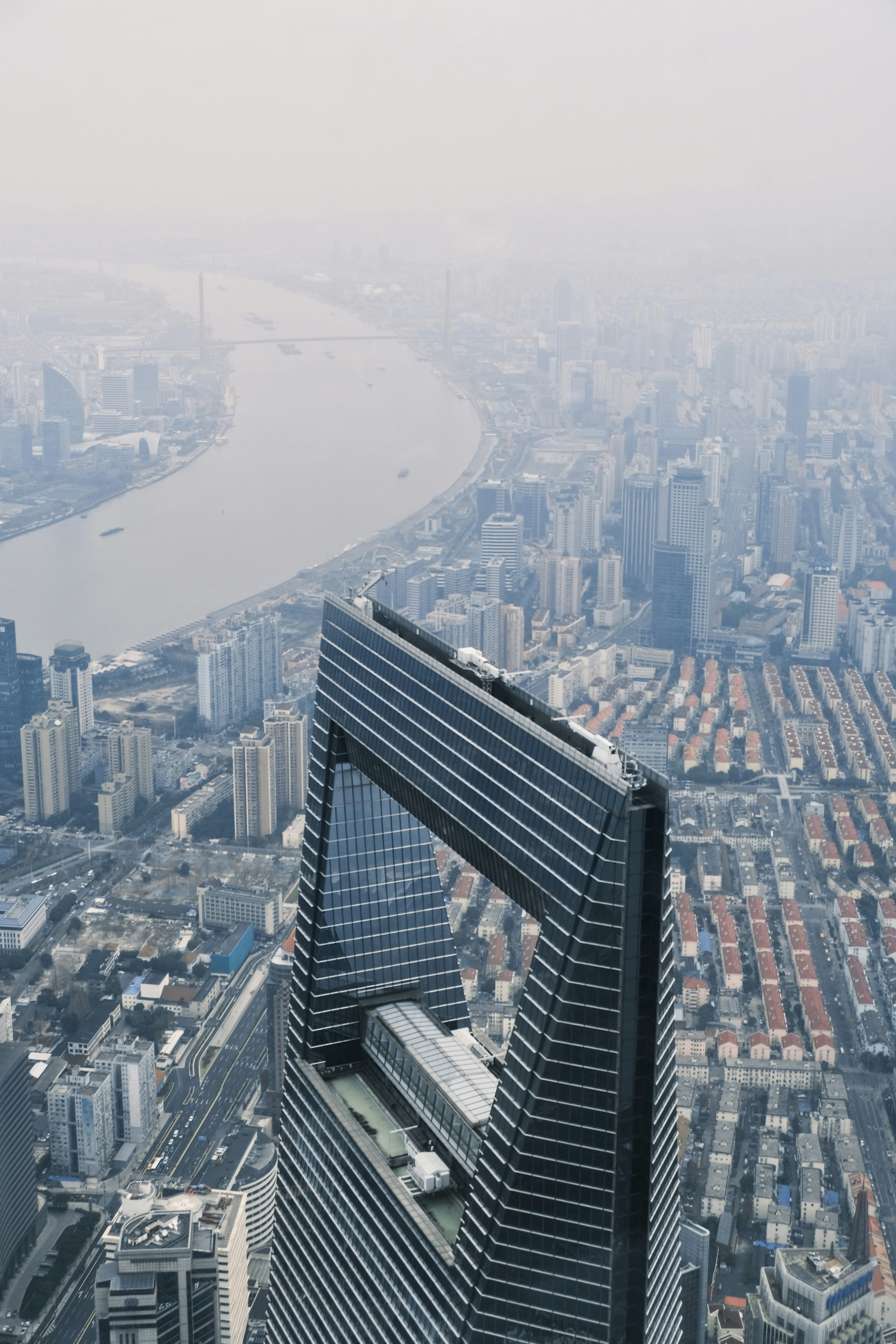 Arrowhead Tower Rising Through a Misty River City