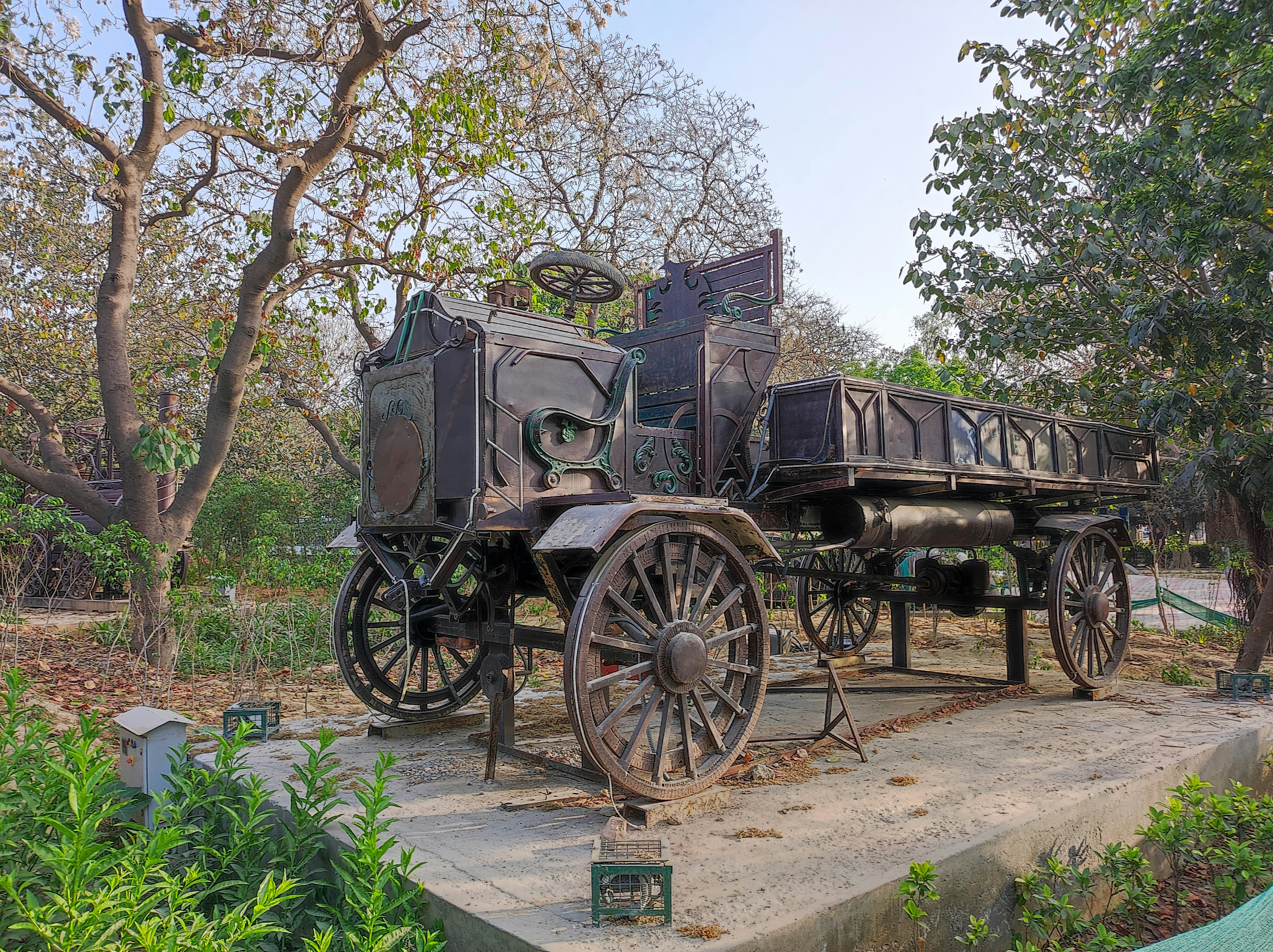 Timeworn Wagon on a Park Pedestal: Quiet History in a Green Clearing