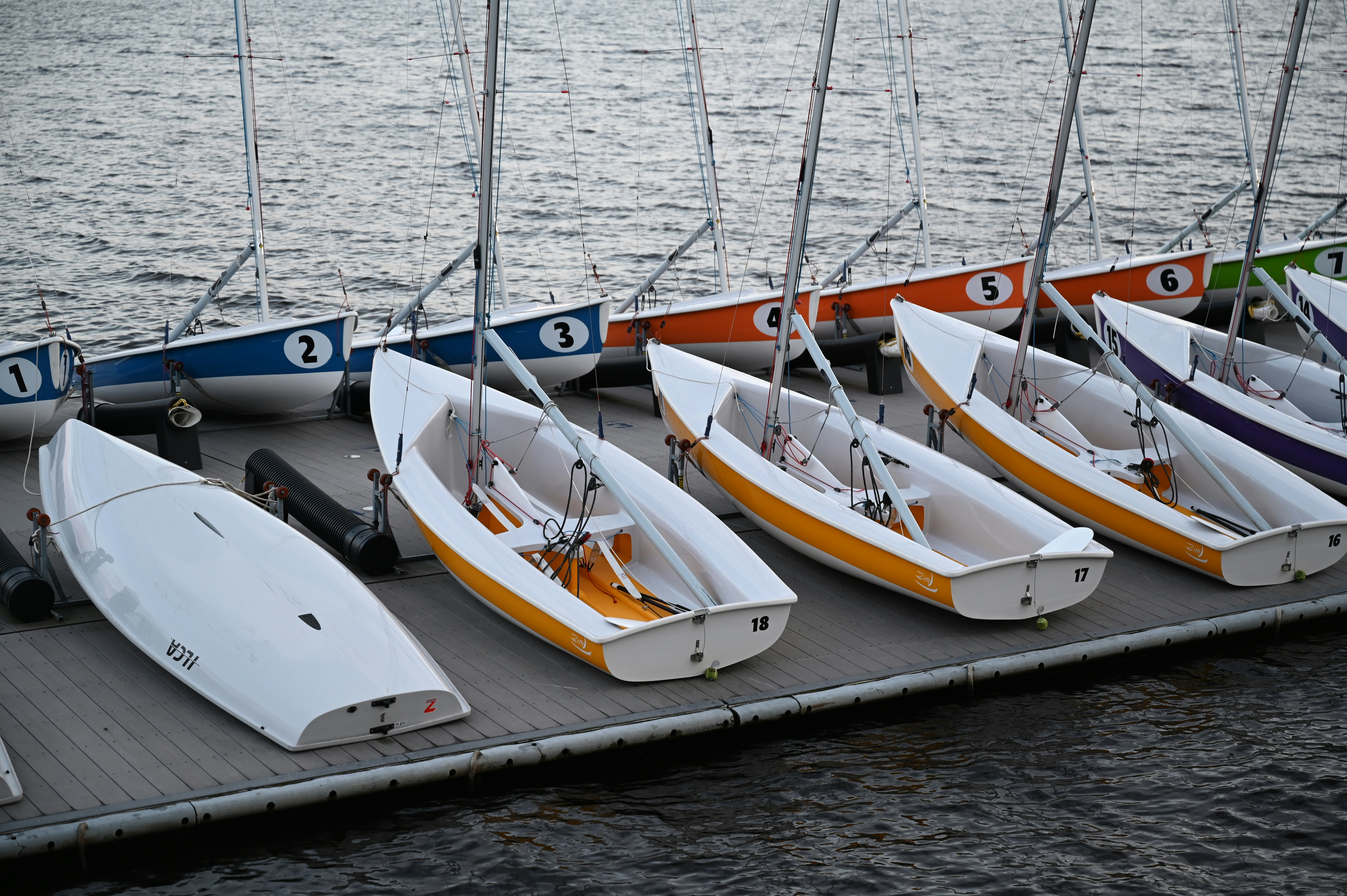 Row of Colorful Dinghies Docked in a Quiet Marina