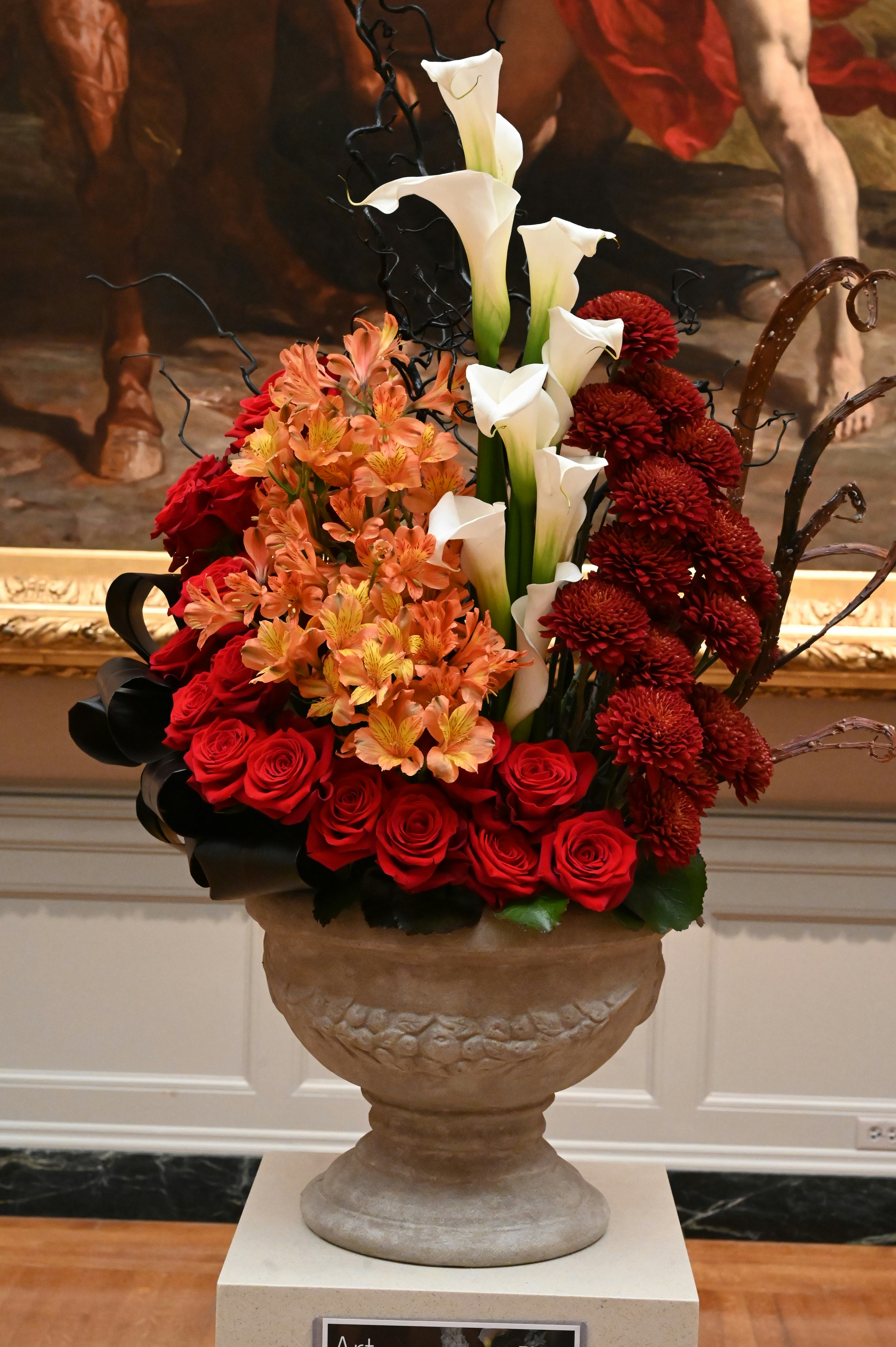 Elegance in Scarlet and Ivory: A Floral Tapestry in a Heritage Vase