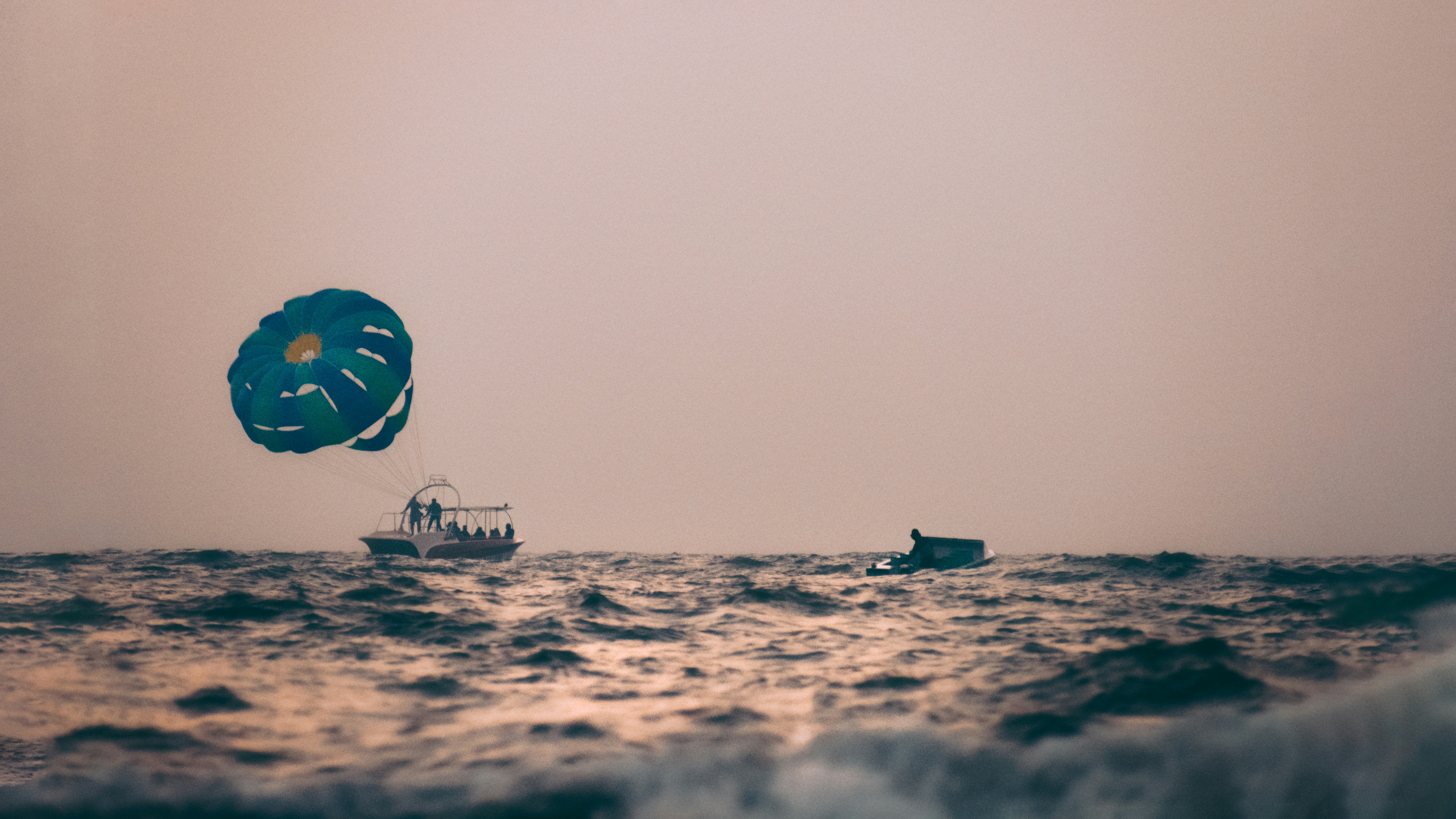 A parachute over a boat photo – Free Vehicle Image on Unsplash