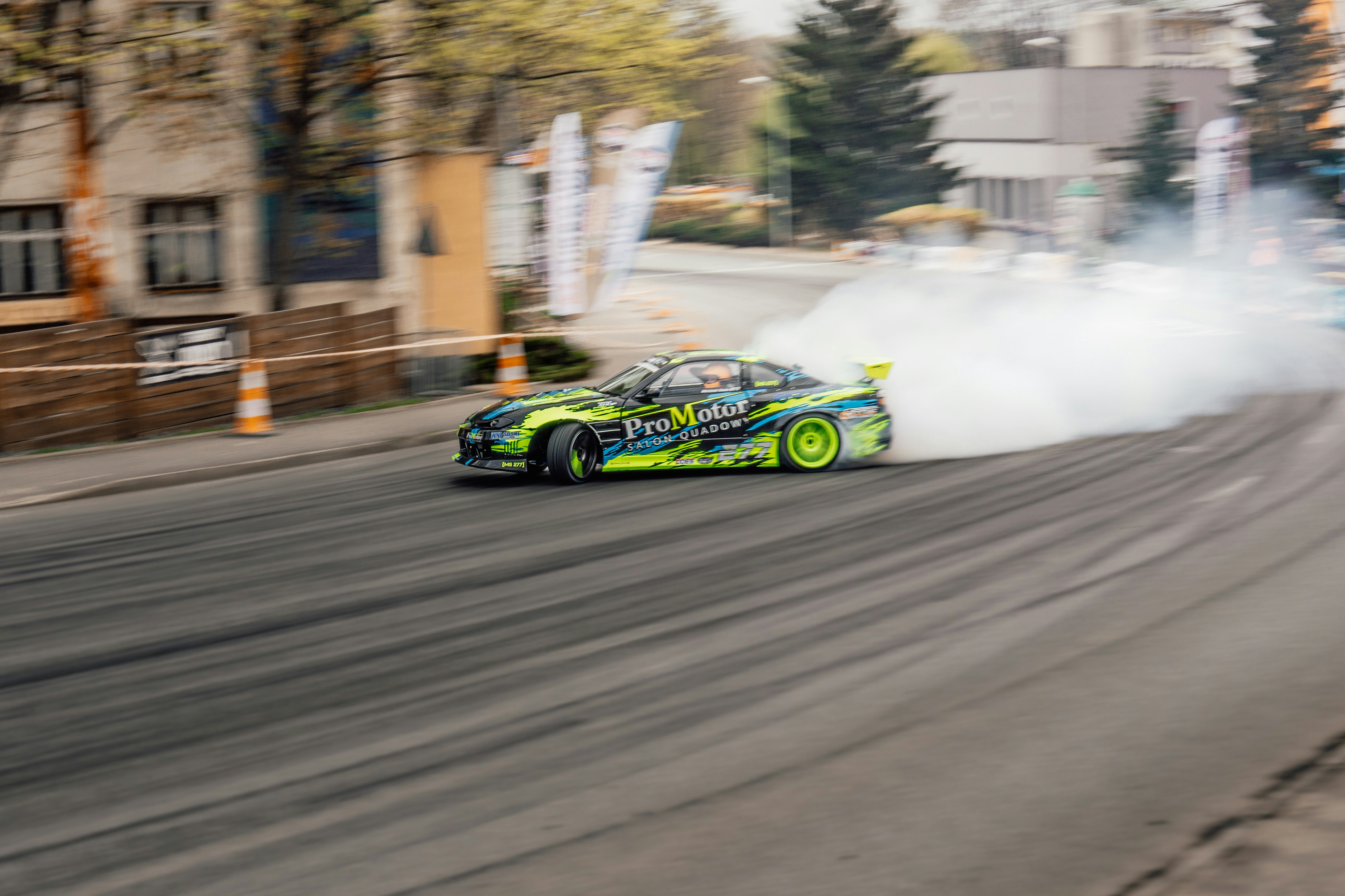 Neon Drift: Green Thunder Leans Into Smoke on the City Street
