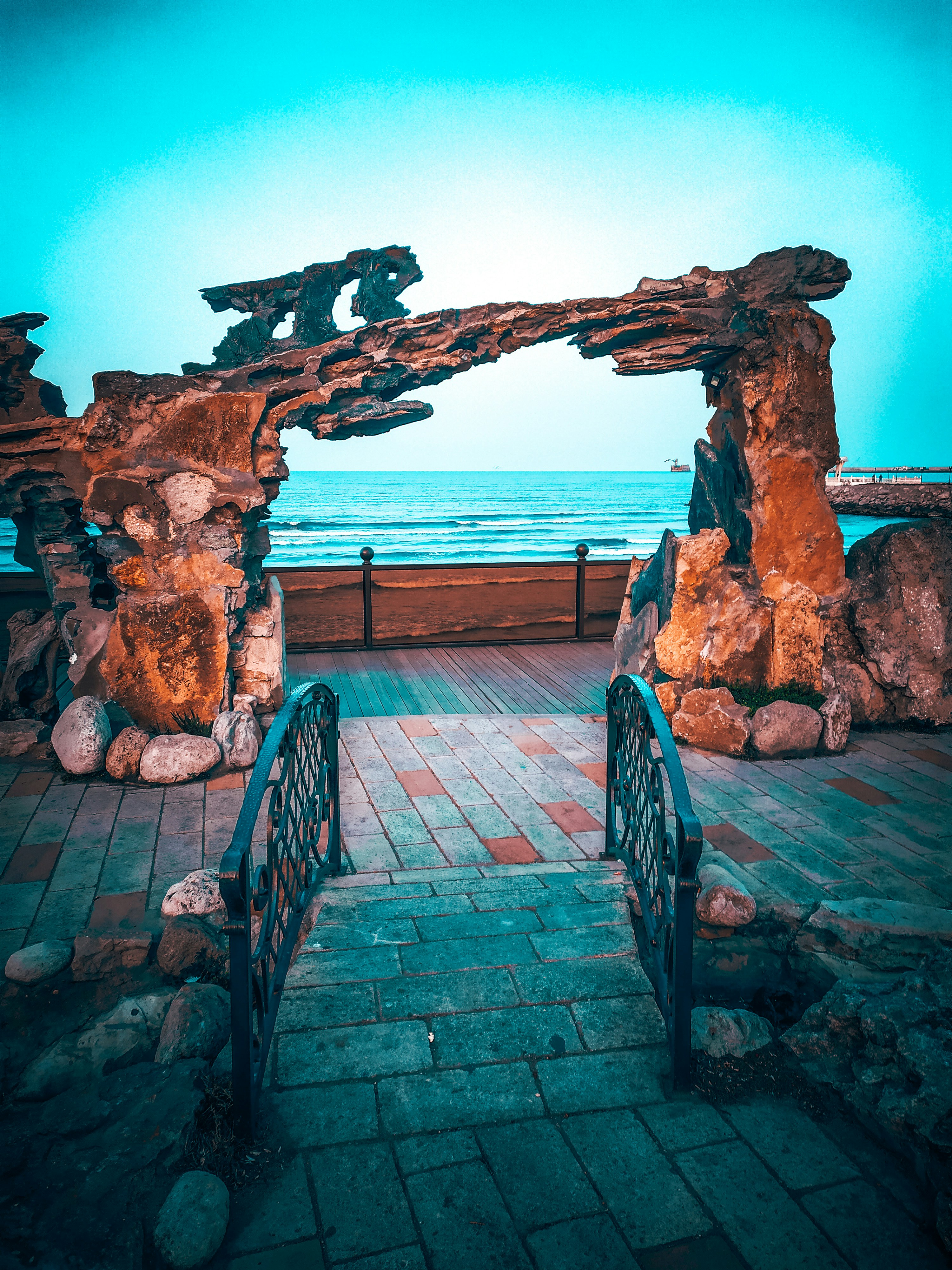 Rugged Archway by the Sea: A Stone Gateway Framing the Horizon
