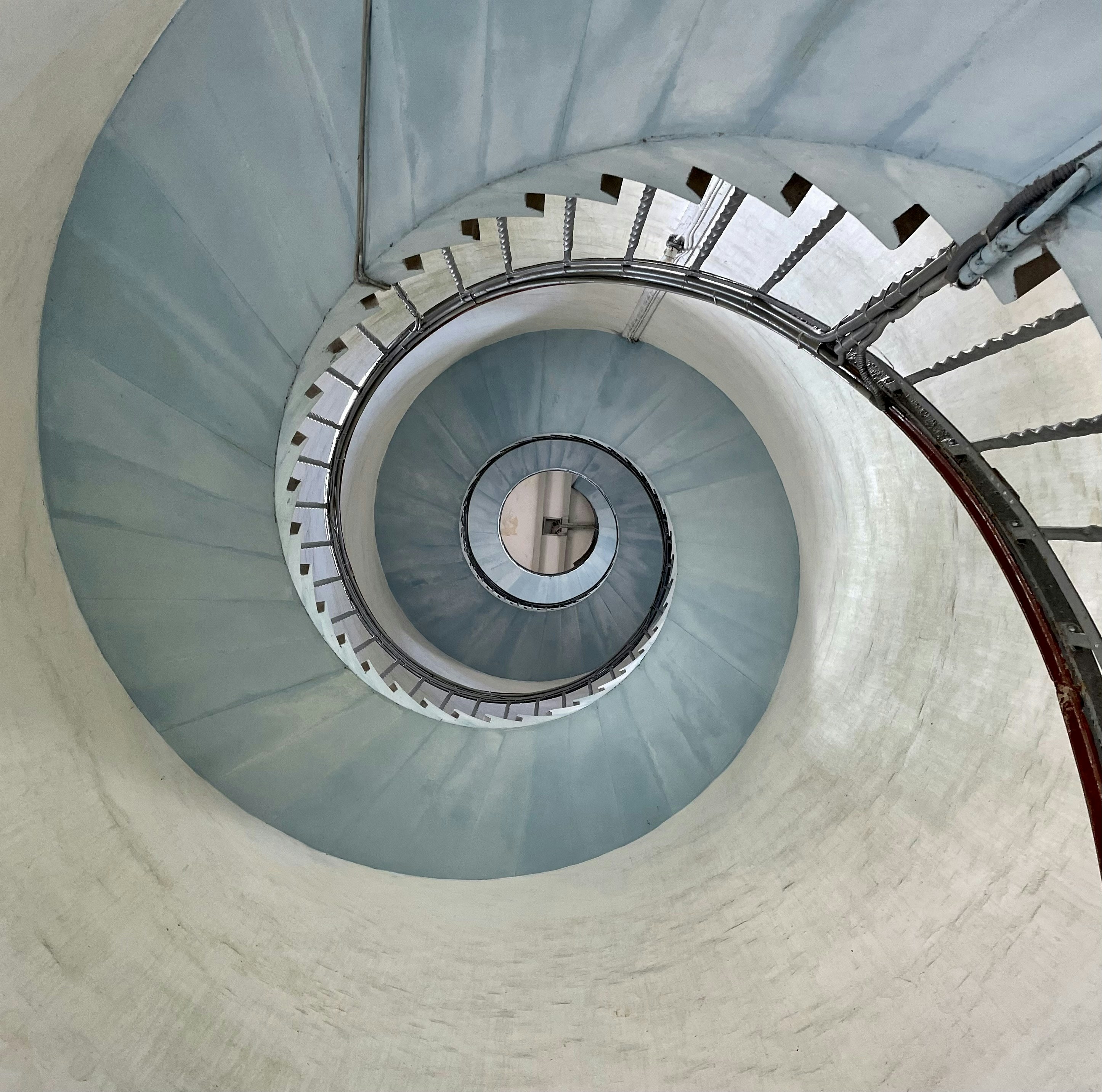 A spiral staircase with a circular opening photo – Free Grey Image on ...