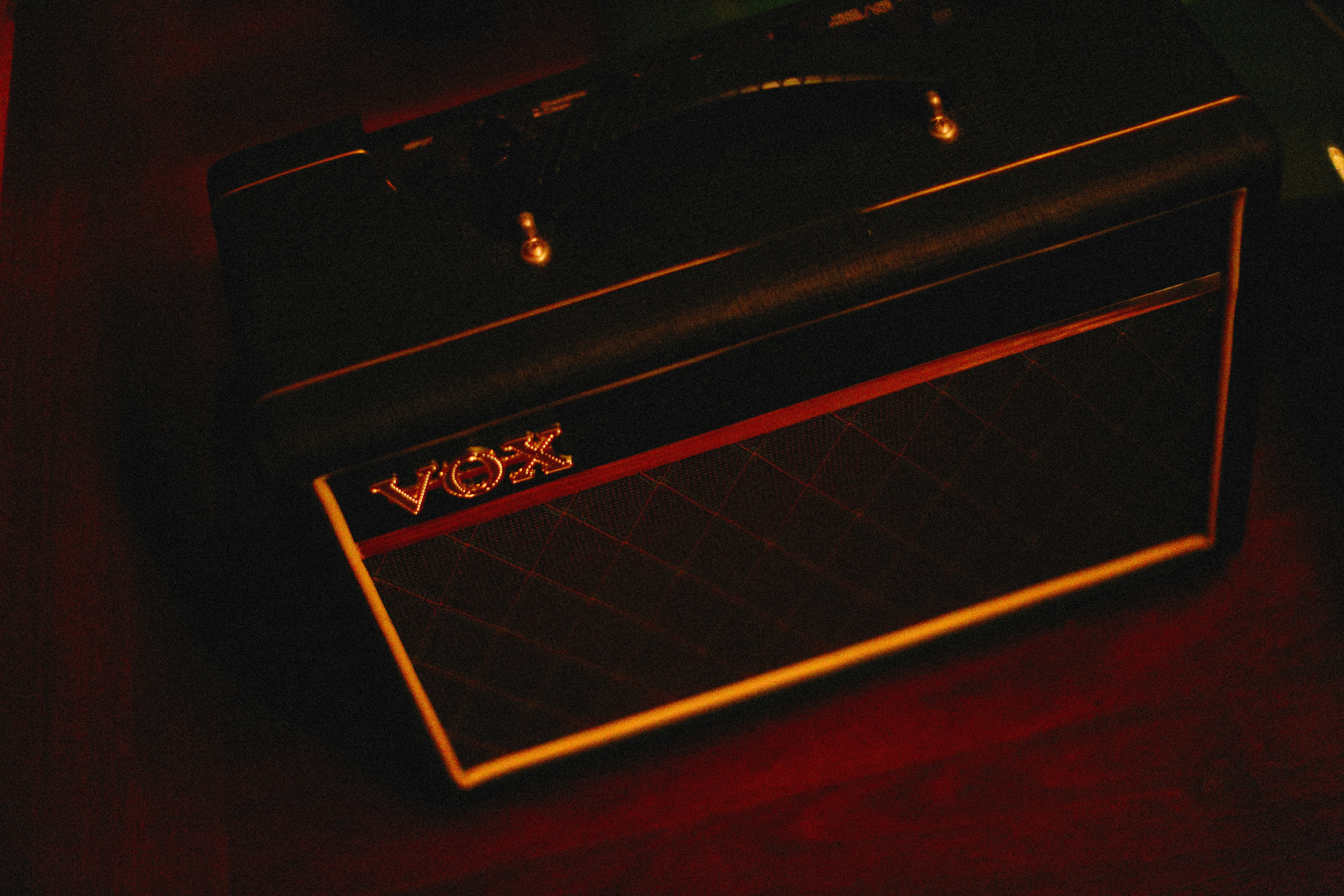 Low-Glow Vox: A Vintage Amp in Shadowed Warmth